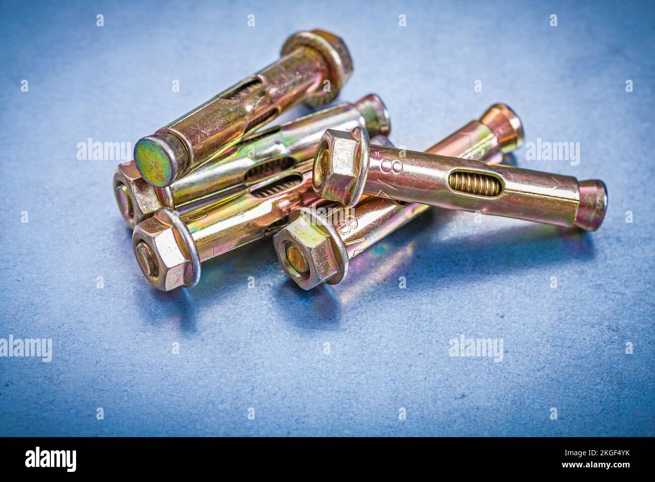 Set of metal anchor bolts for concrete walls on metallic background ...