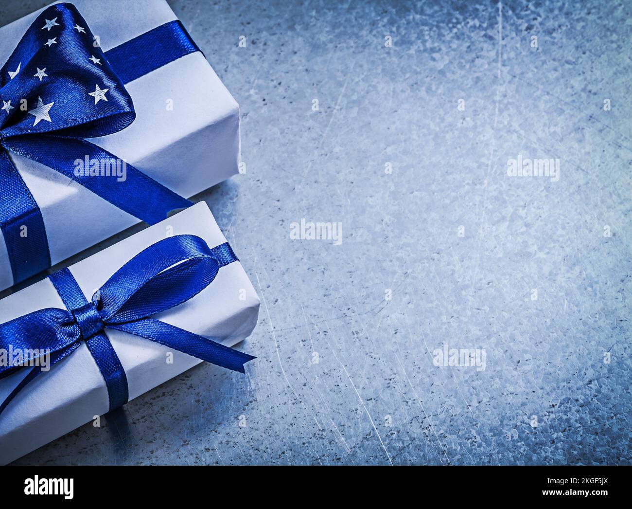 Set of wrapped gift boxes on metallic background celebrations concept ...