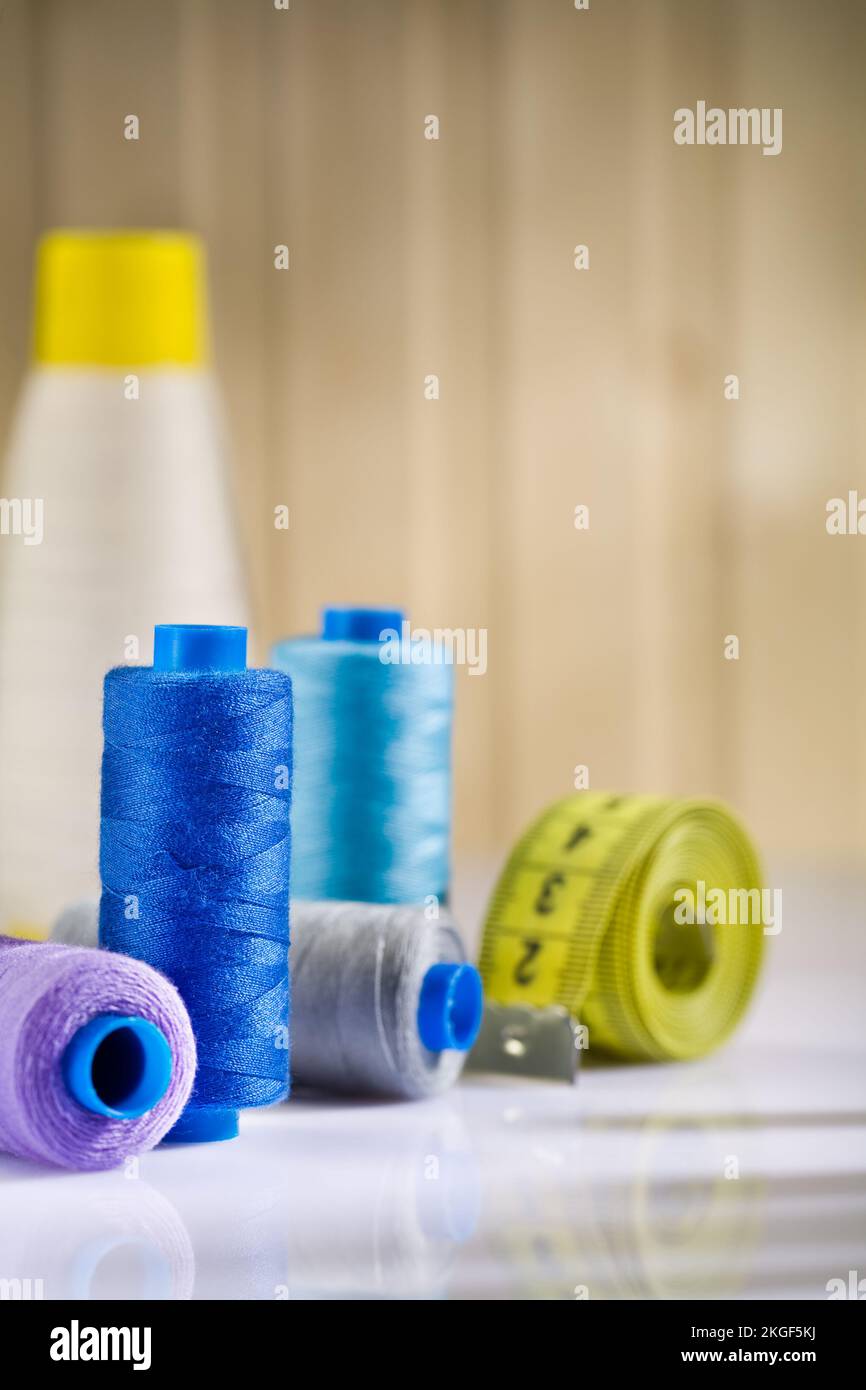 sewing spools with threads and tapeline Stock Photo - Alamy