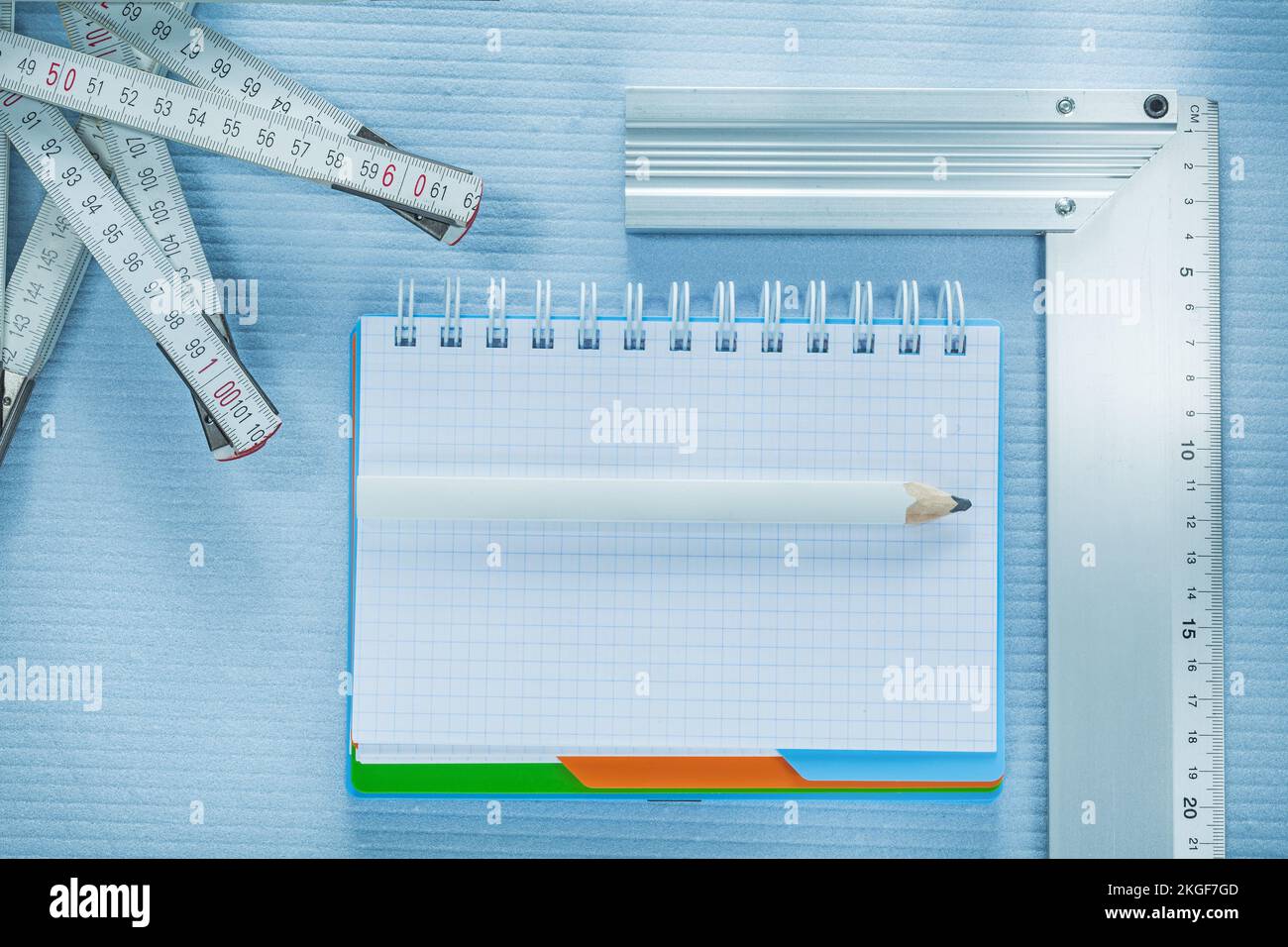 Square ruler checked notepad pencil tape measure Stock Photo - Alamy