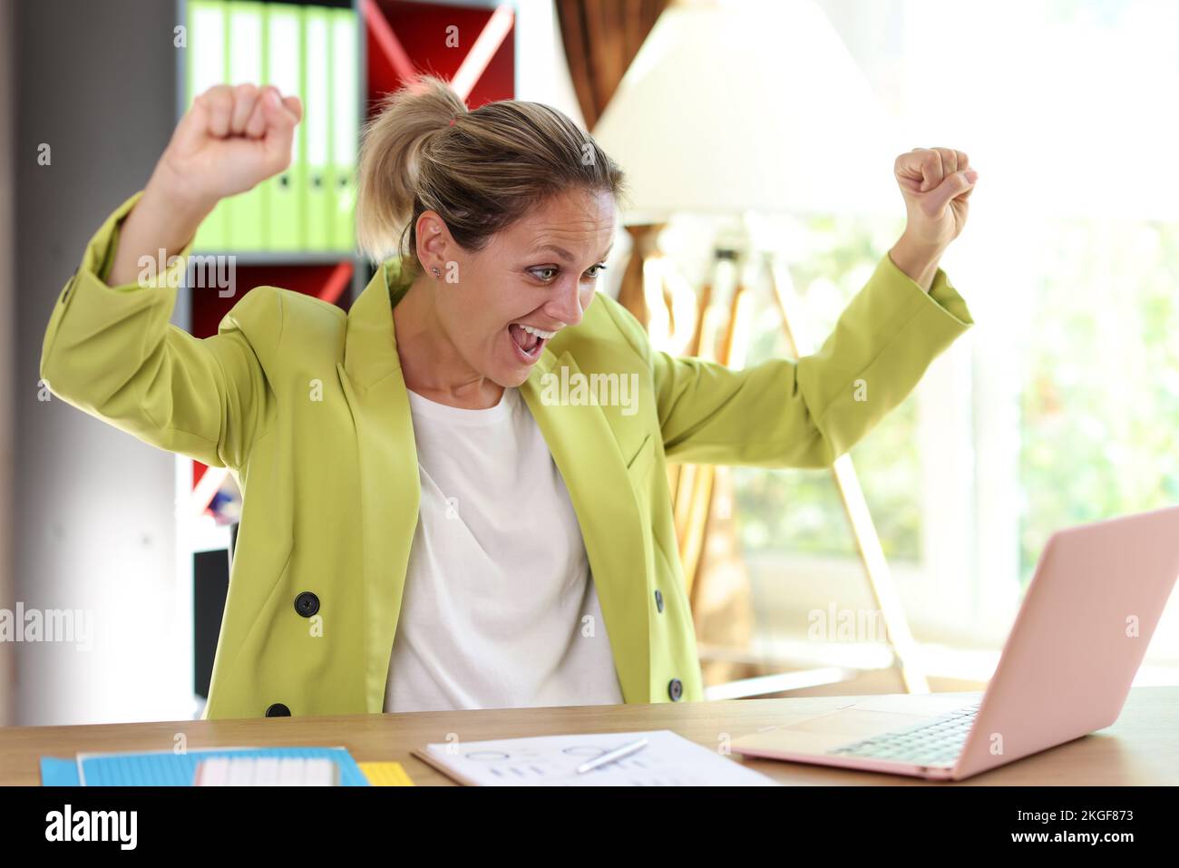 Happy excited business woman with raised hands and laptop. Woman ...
