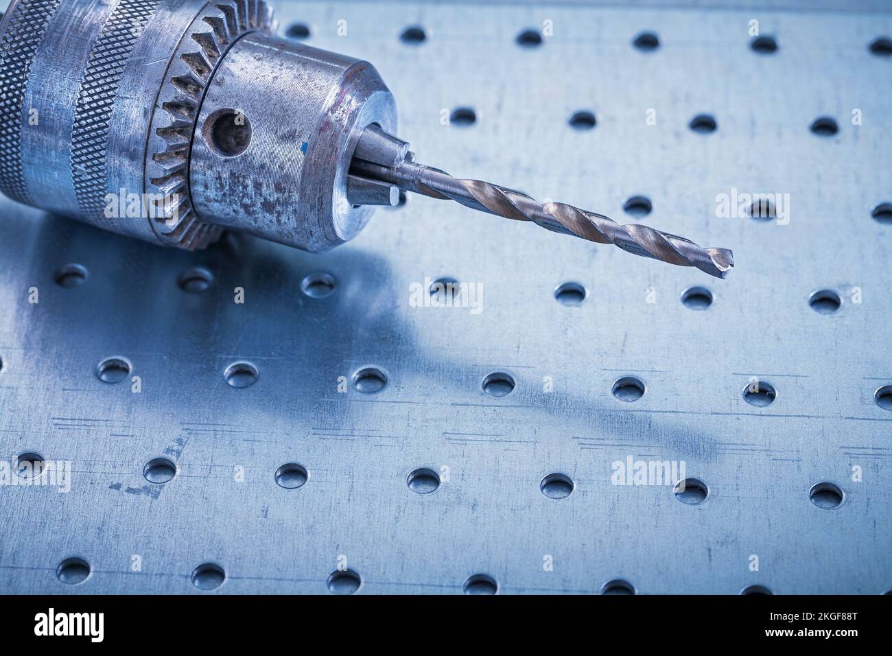 Stainless drill on drilled metal sheet construction concept Stock Photo ...