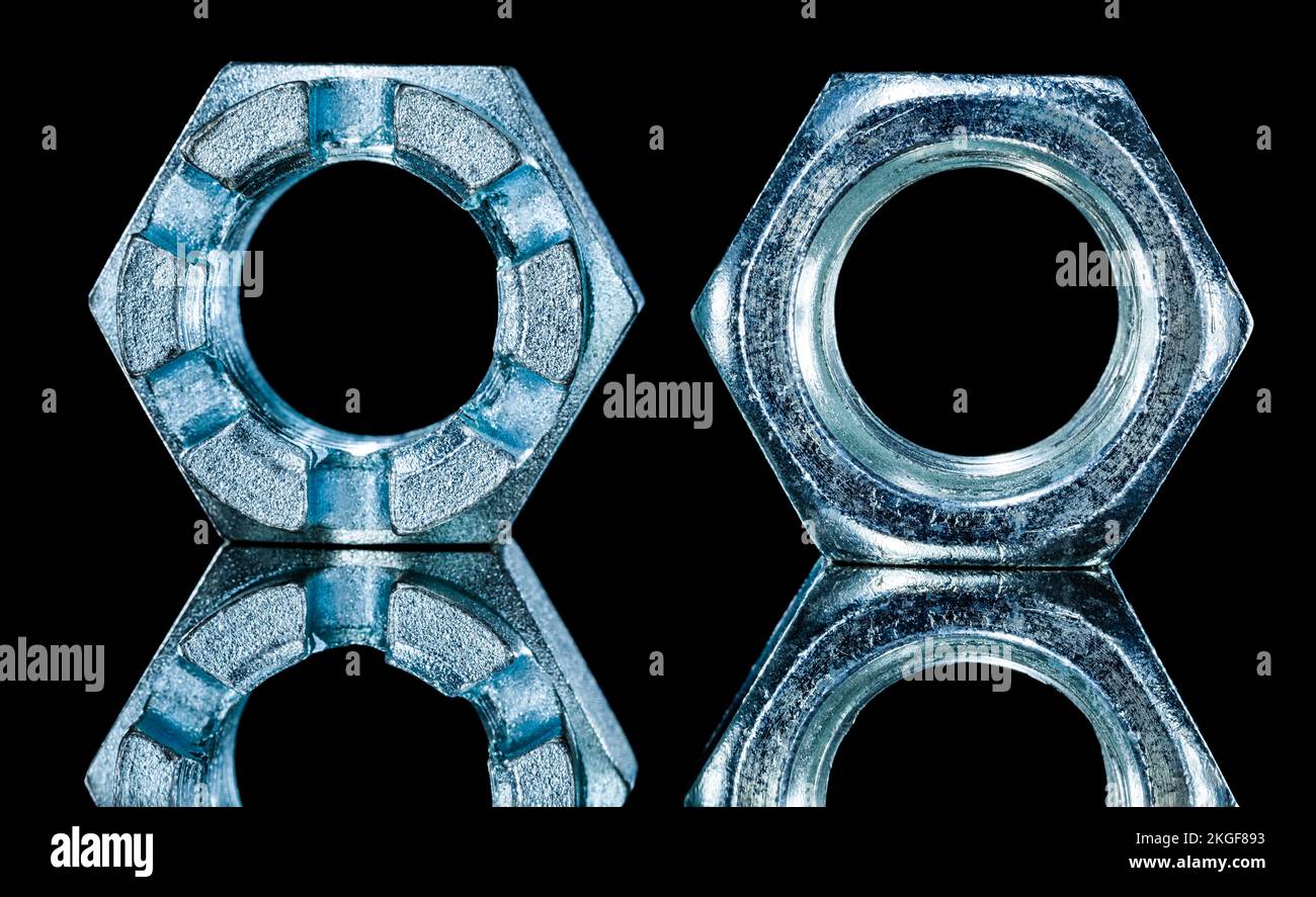 Stainless crown nuts on black surface Stock Photo - Alamy