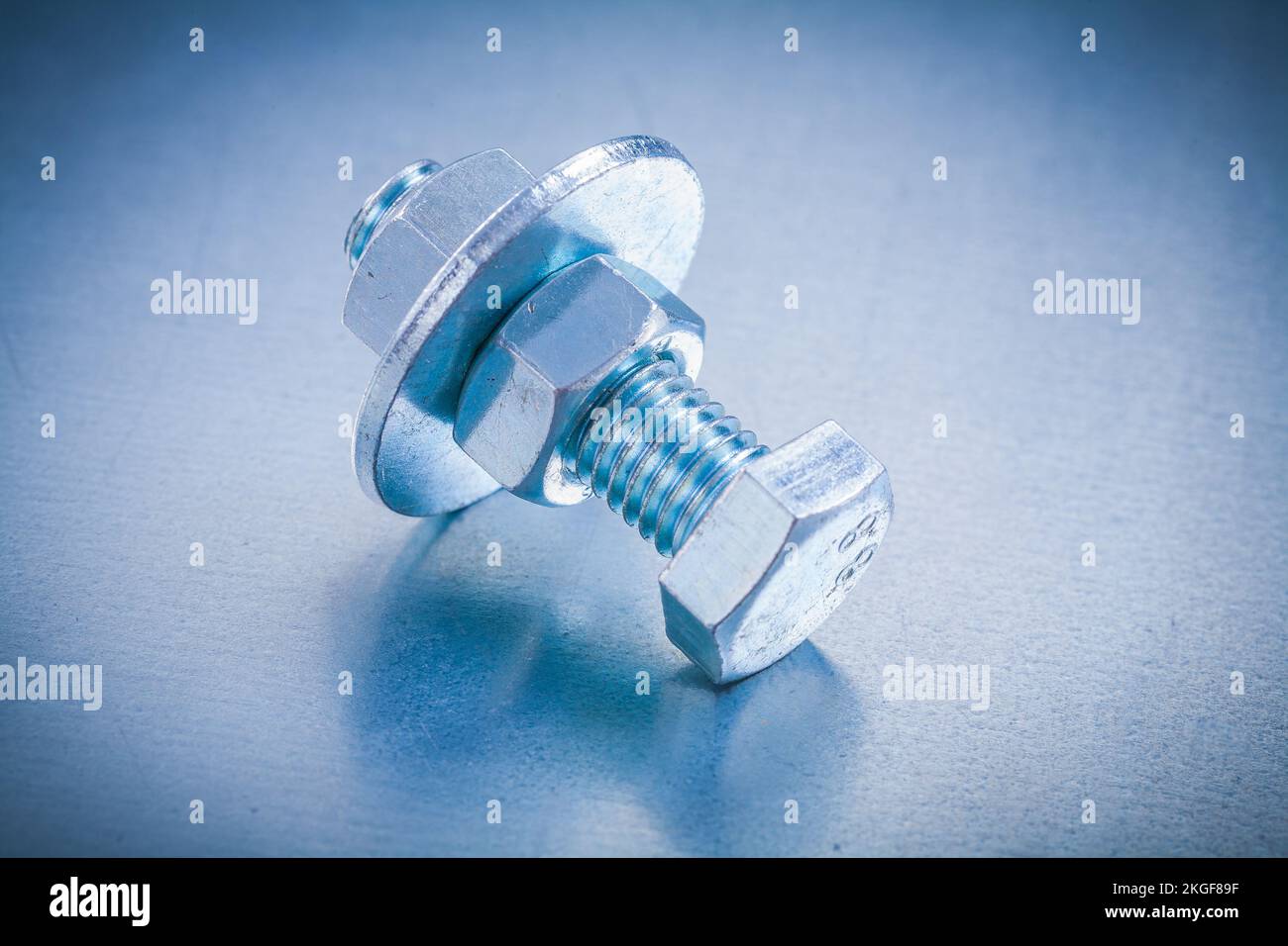 Stainless screwbolt with bolt washer and construction nuts on metallic ...