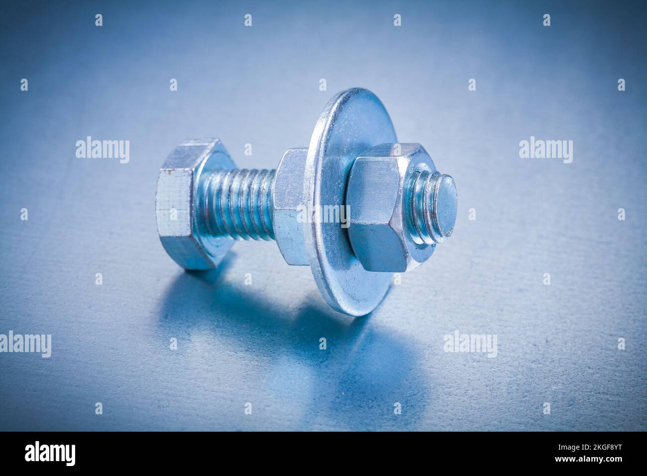 Steel screwbolt with bolt washer and construction nuts on metallic ...