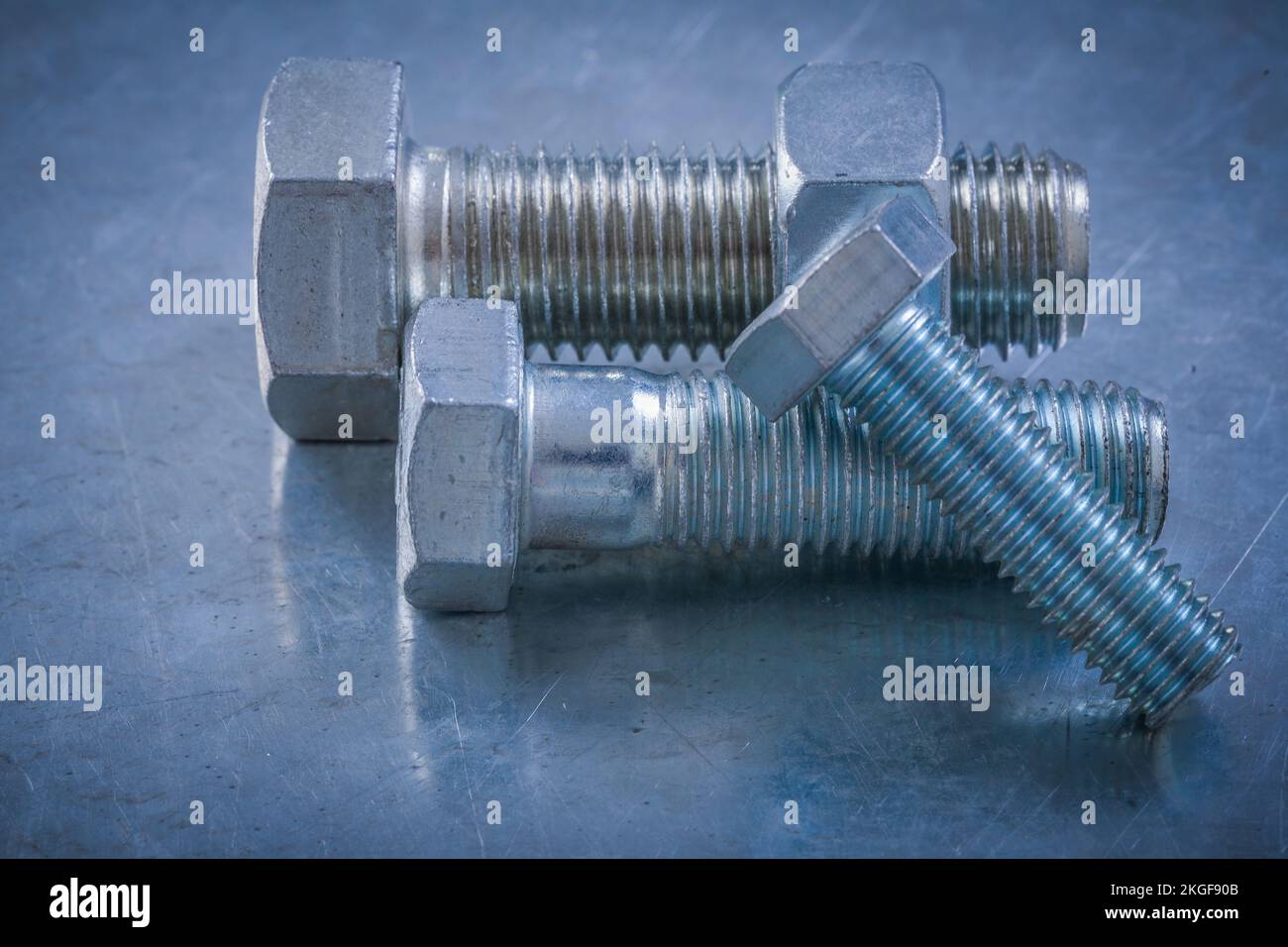 Steel screw-nuts with bolt on metallic background maintenance concept ...