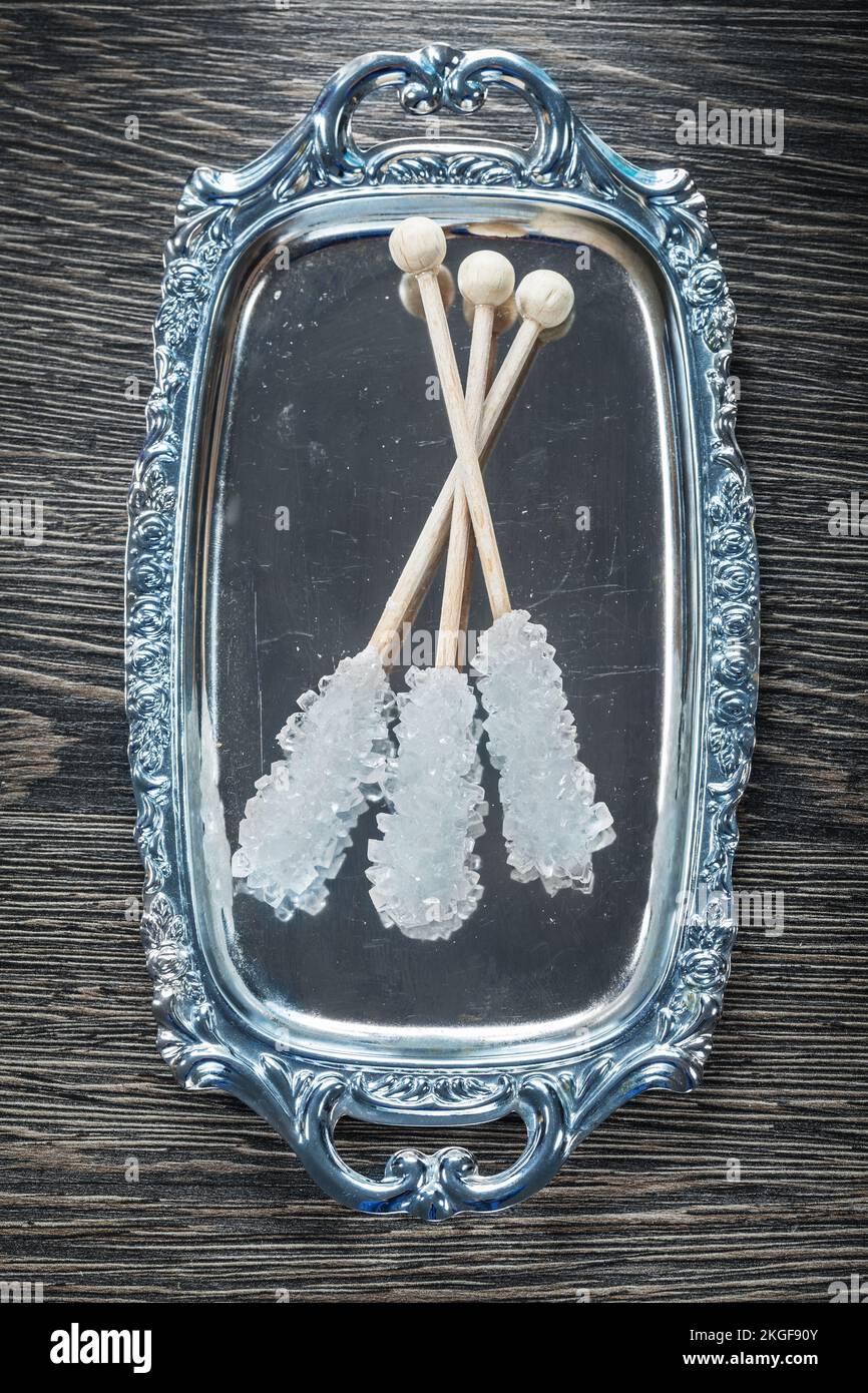 Sugar sticks tray on wooden board Stock Photo - Alamy