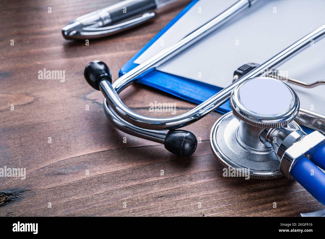 stethoscope clipboard ballpoint pen on vintage wooden board medical ...