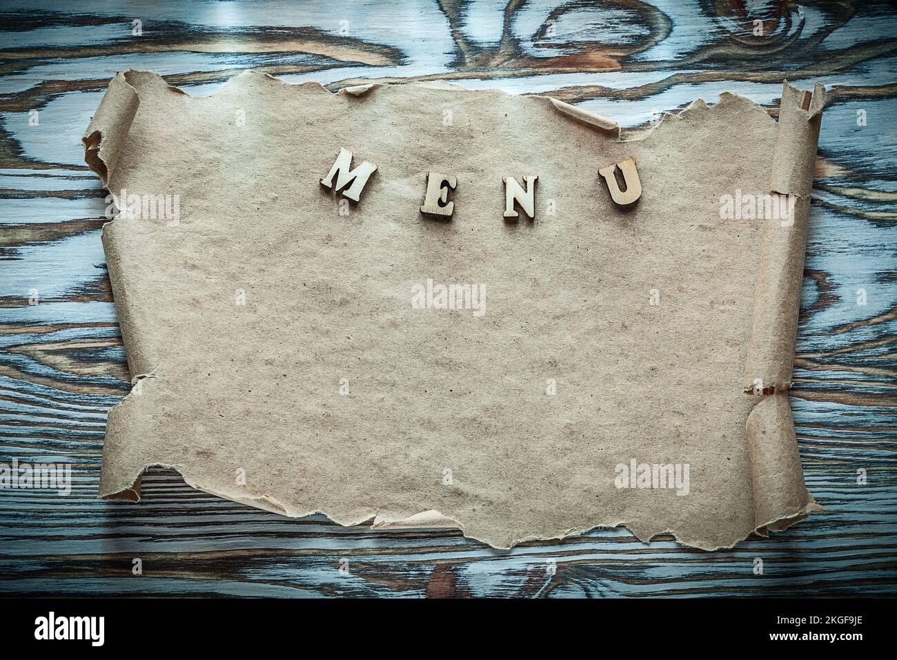 Text paper roll on vintage wooden surface Stock Photo - Alamy