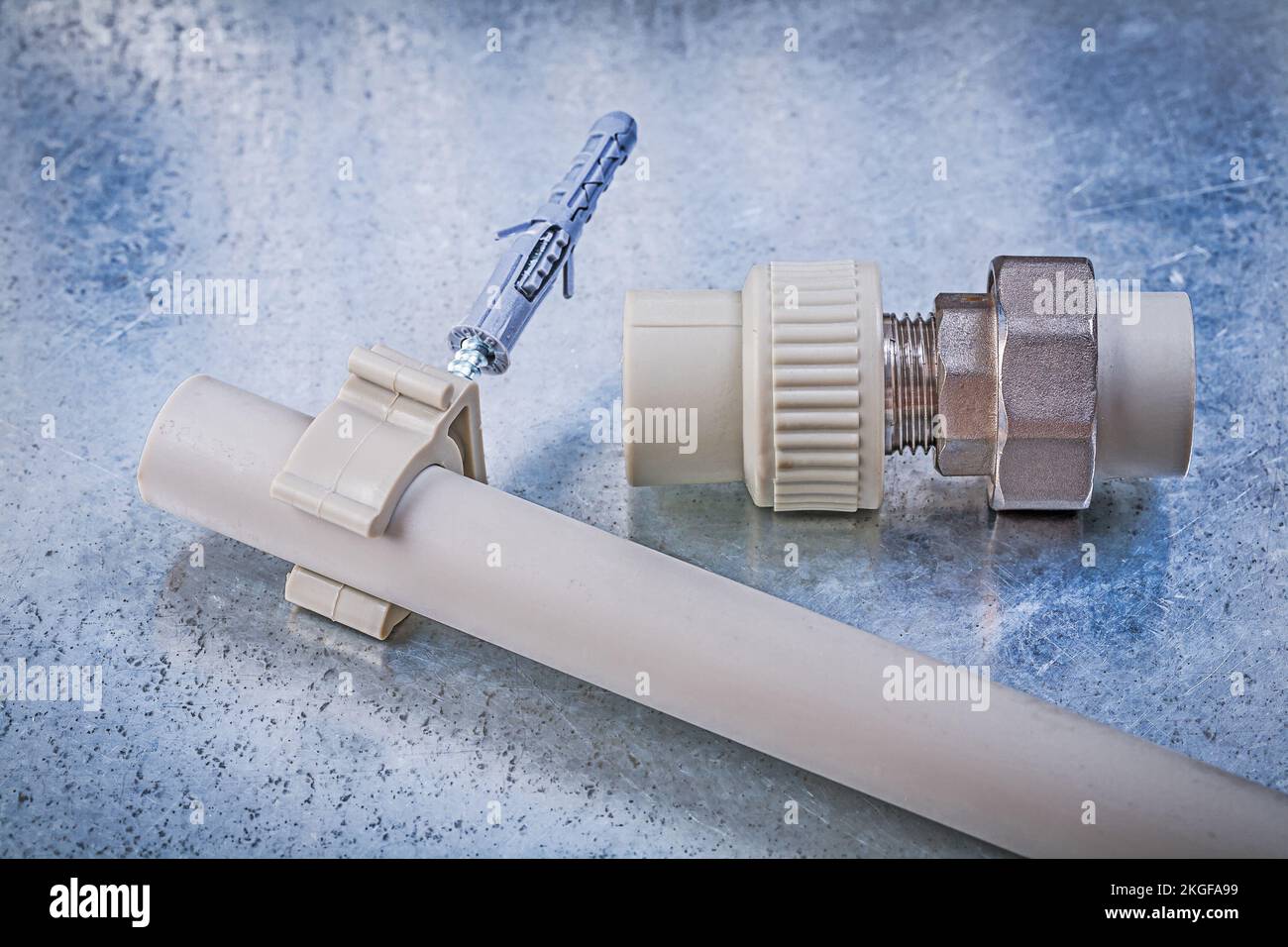 Threaded pipe connector clamp water tube on metallic background ...