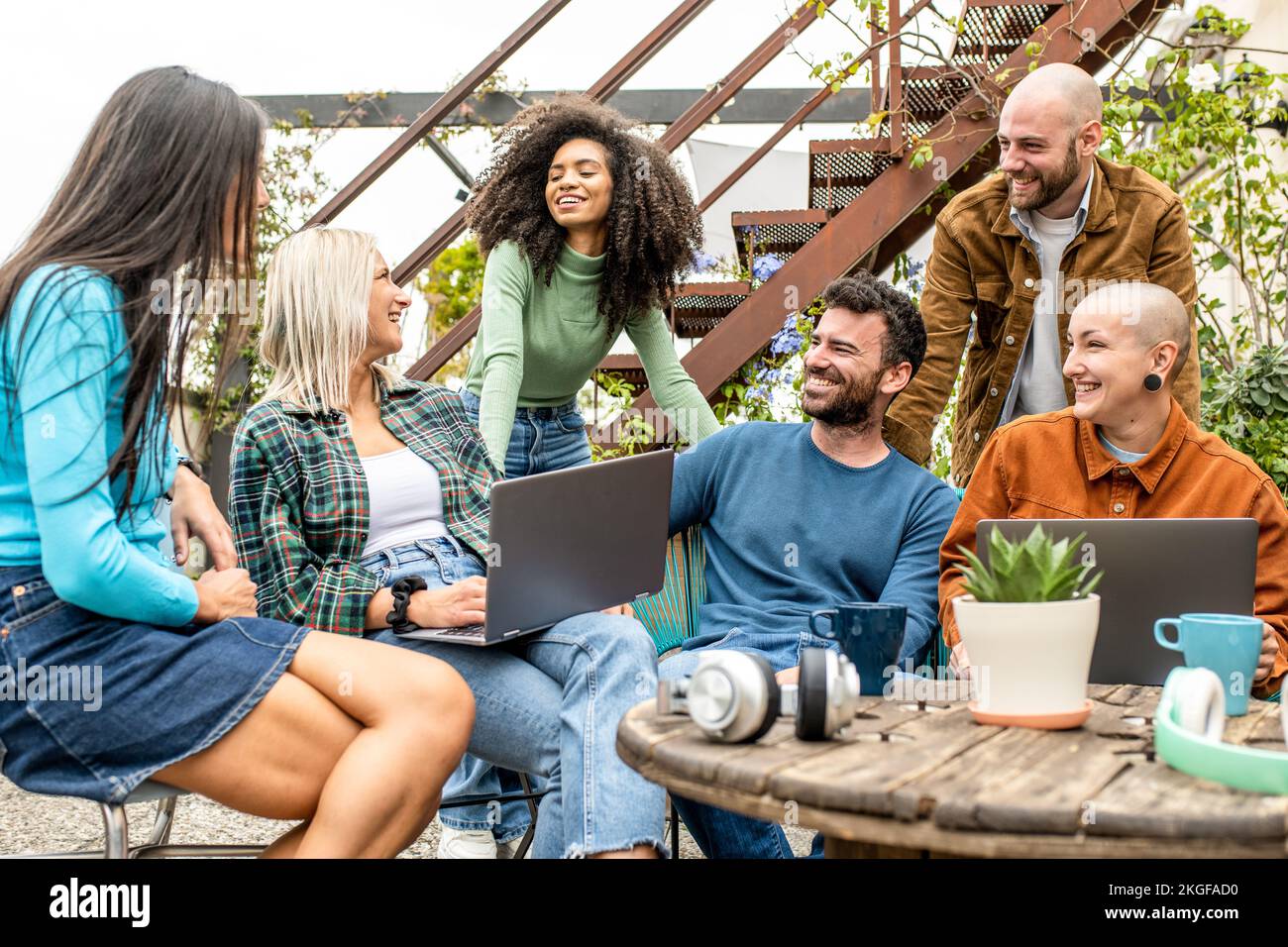 Digital native group of friends sharing content and ideas in team work ...