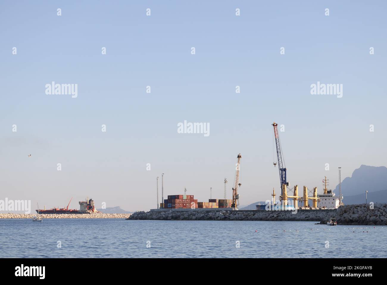 Sea side view on industry sea port on mountain background Stock Photo ...