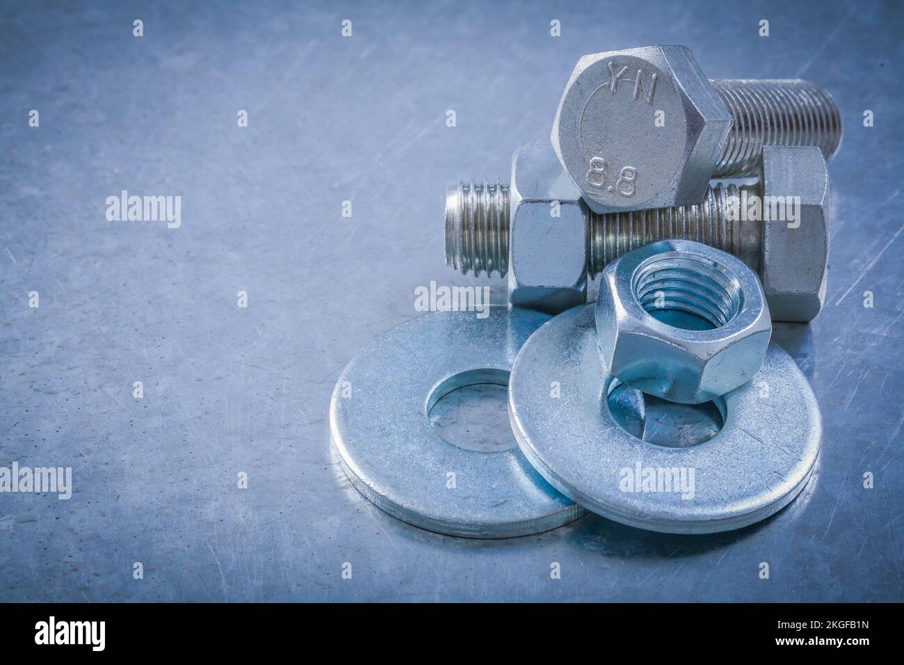 Top view of bolt washers screwbolts screw-nuts on metallic background ...