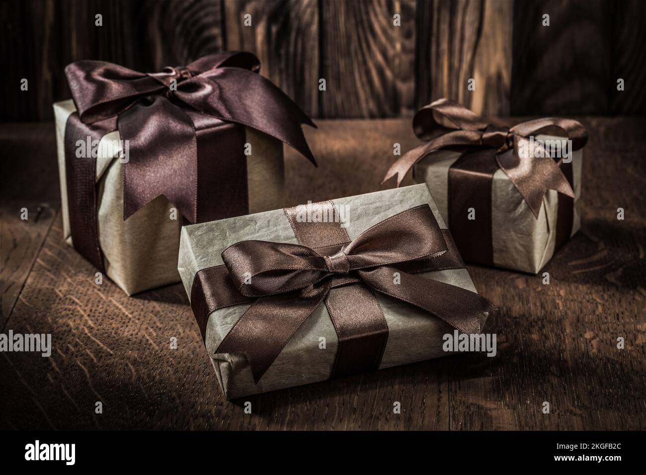 three vintage gift boxes on wood background Stock Photo - Alamy