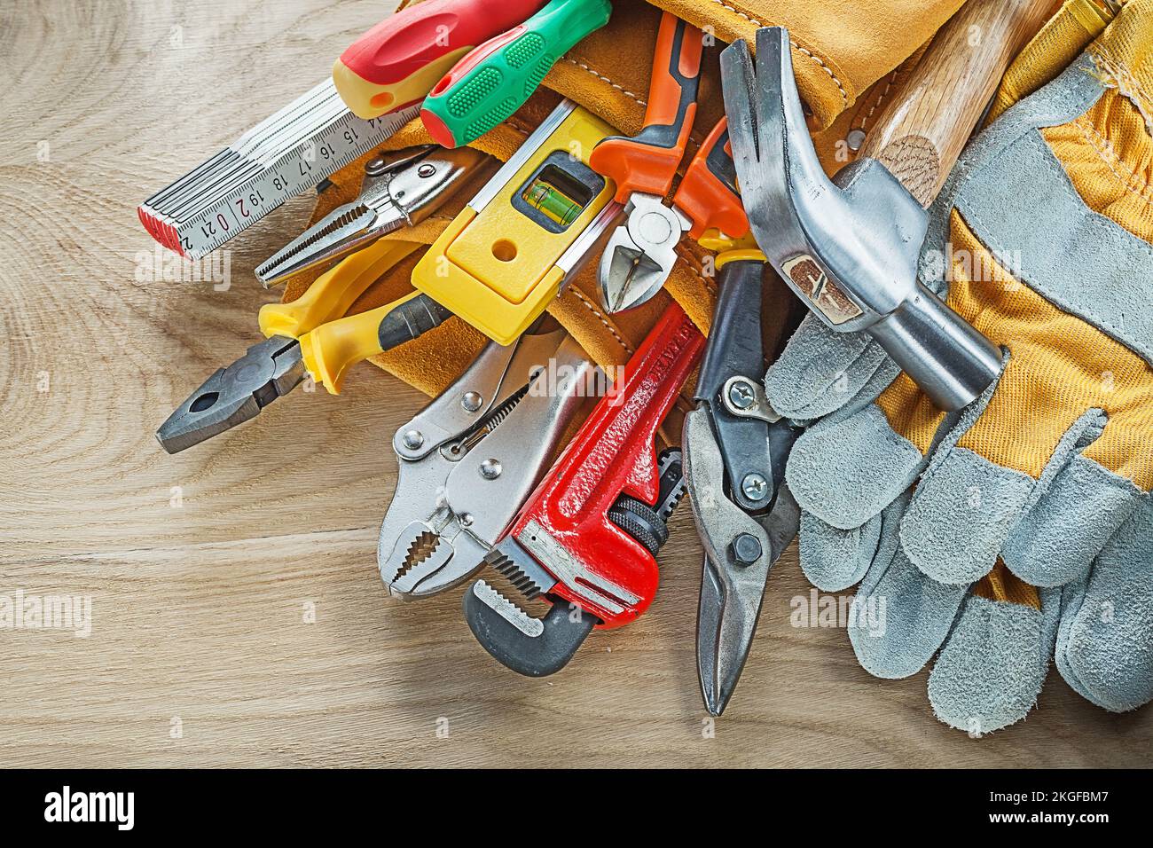 Tools in leather building belt on wooden board top view Stock Photo - Alamy