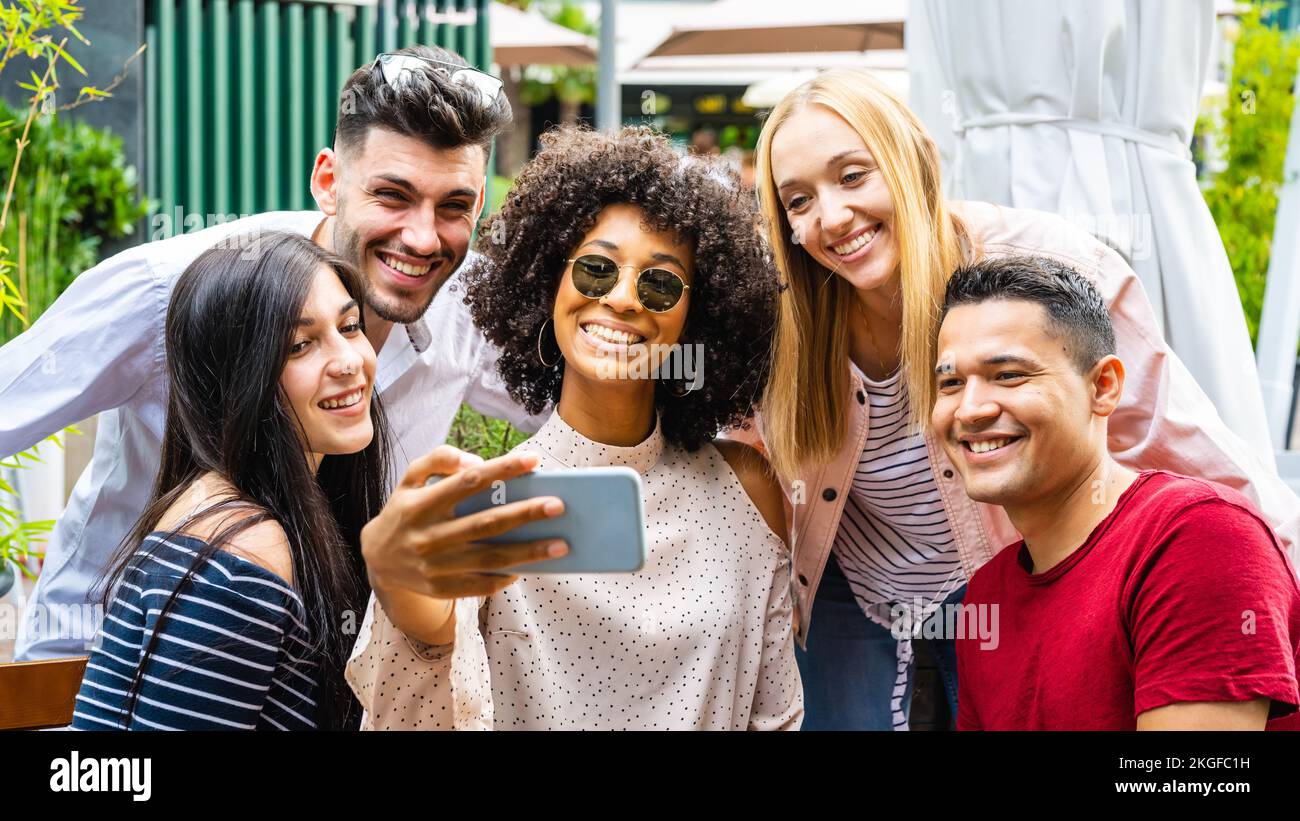 young group of people taking selfie, five person of generation Z ...