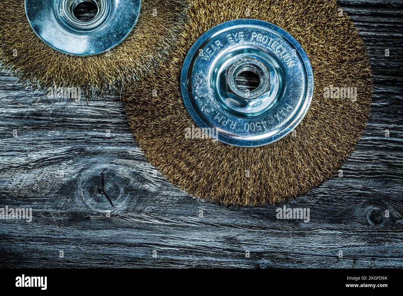 Used wire wheel brushes on vintage wooden board Stock Photo - Alamy