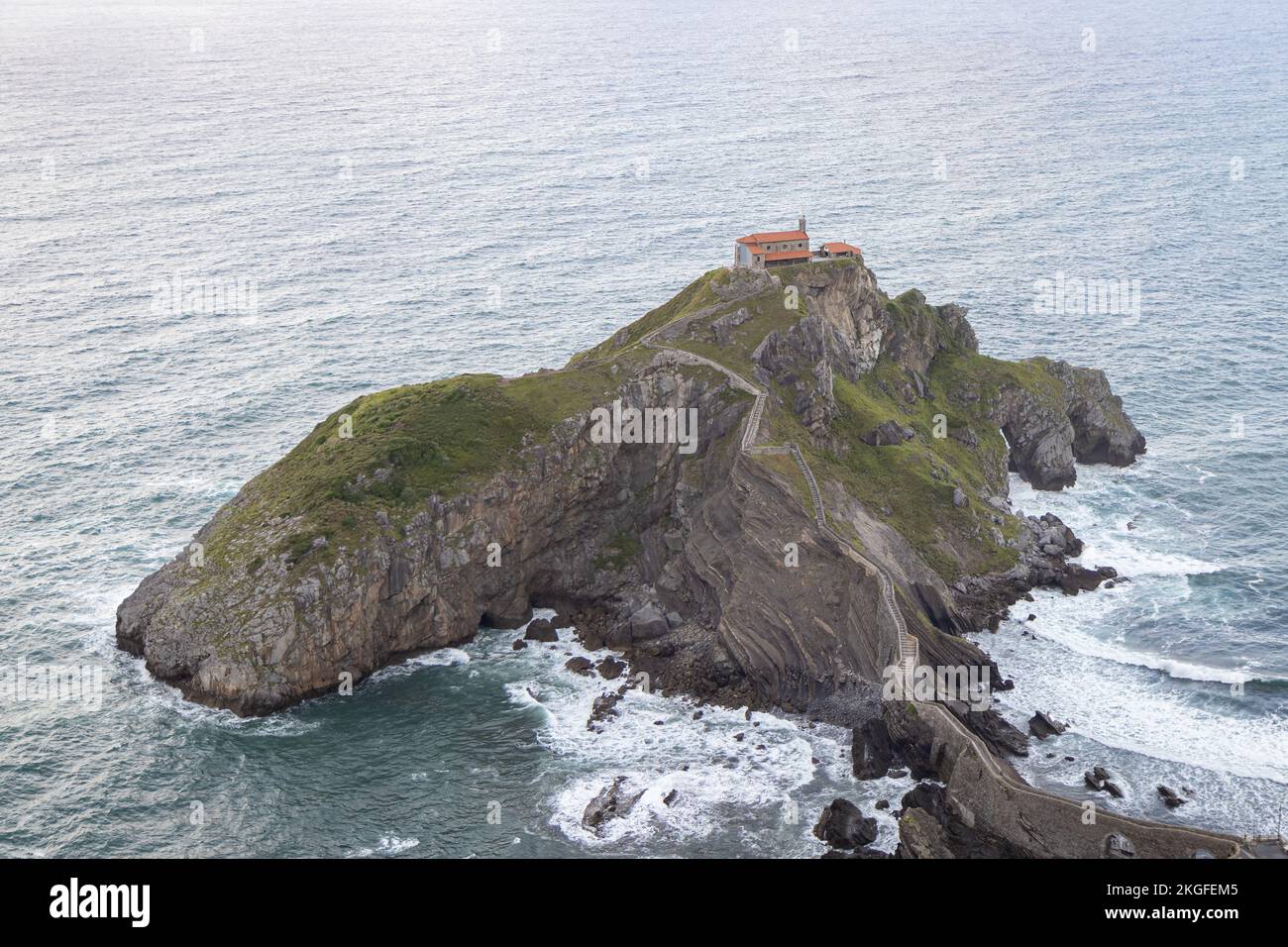 Aerial view of Island (Islet) and the Gaztelugatxe temple in twilight ...