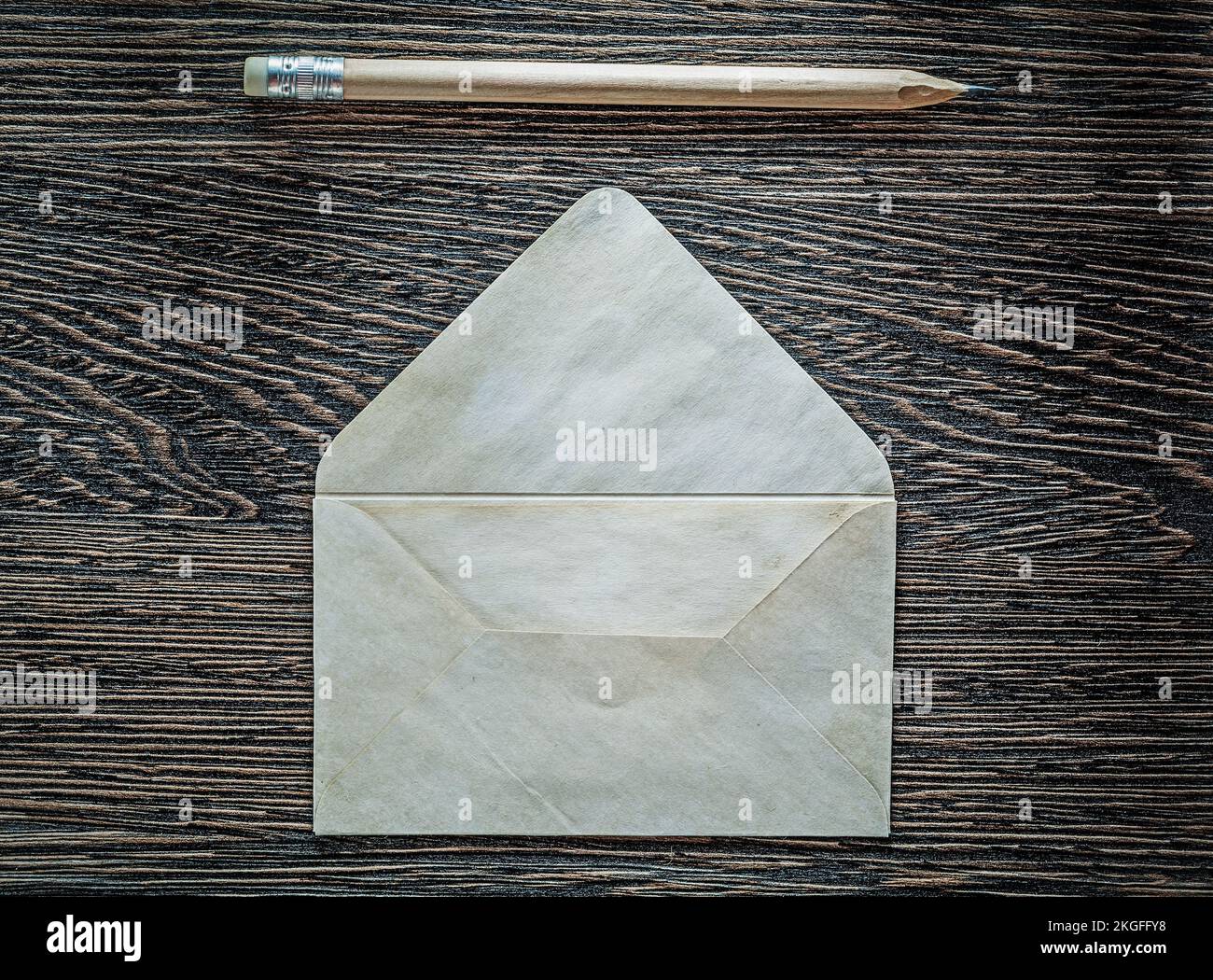 Vintage envelope pencil on black board top view Stock Photo - Alamy