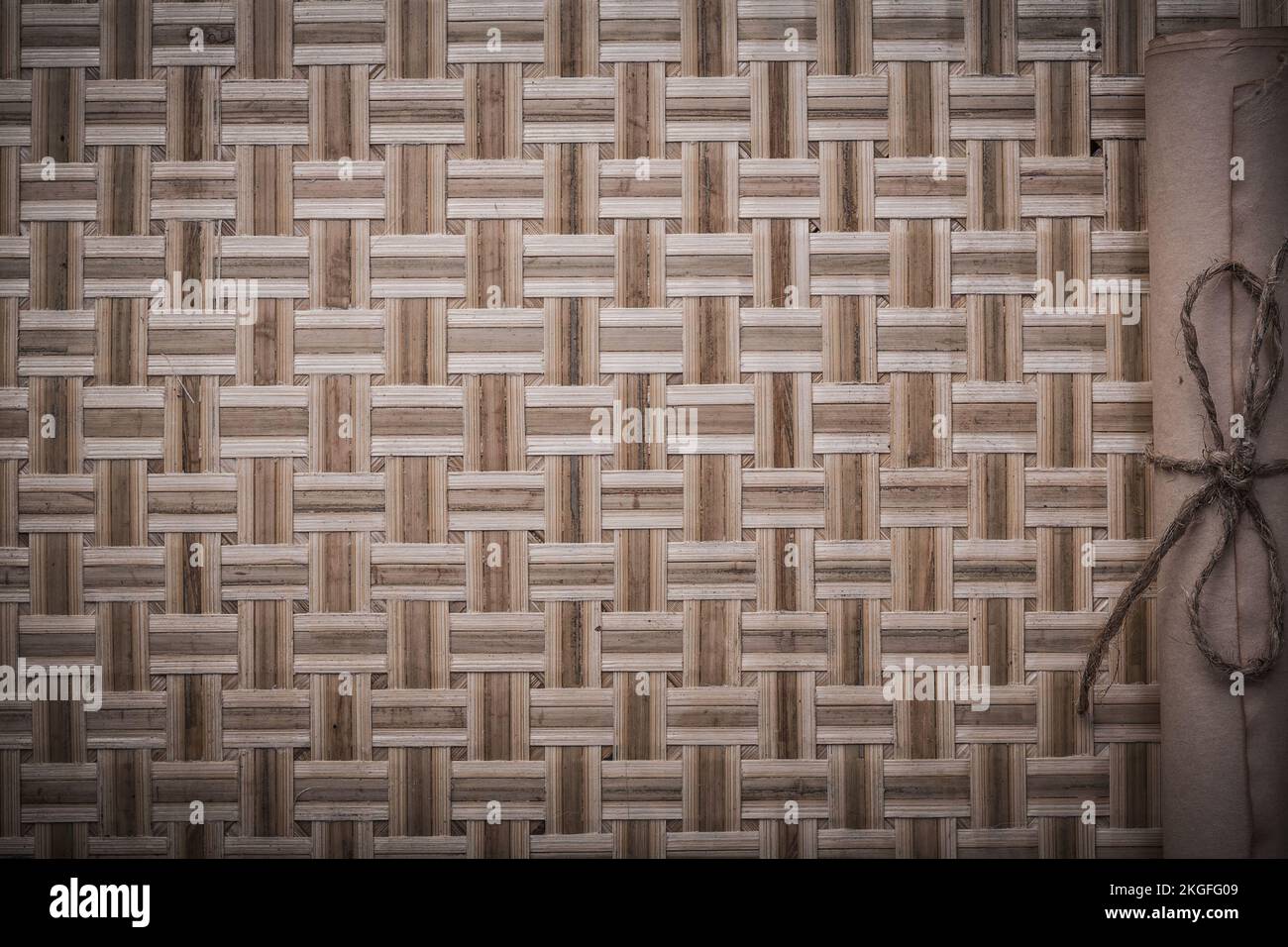 Vintage medieval rolled paper on woven wooden matting copyspace Stock ...