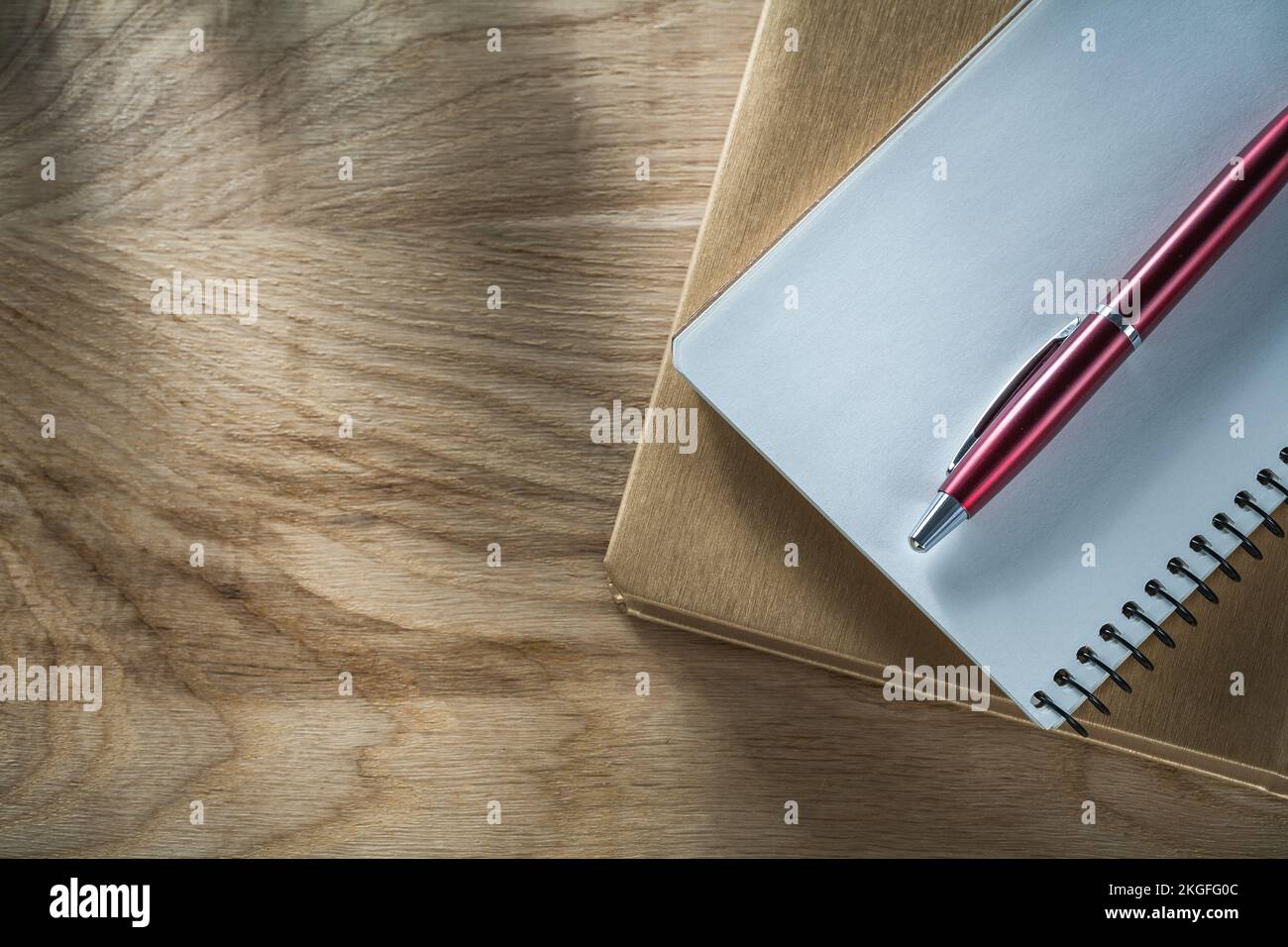 Vintage notepads biro pen on wooden board Stock Photo - Alamy