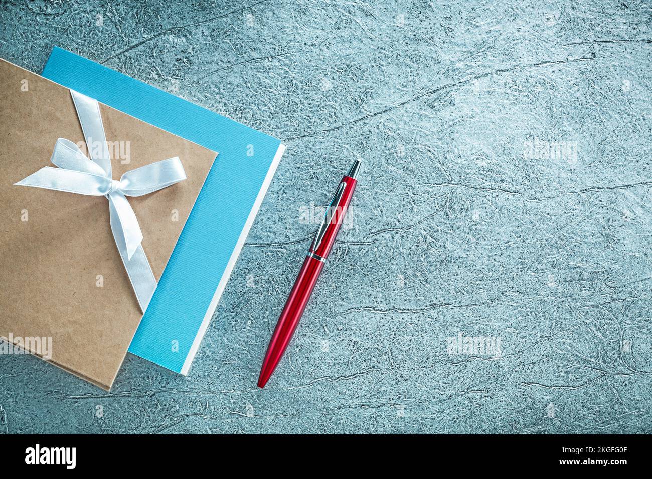 Vintage notebooks pen on silver background top view Stock Photo - Alamy