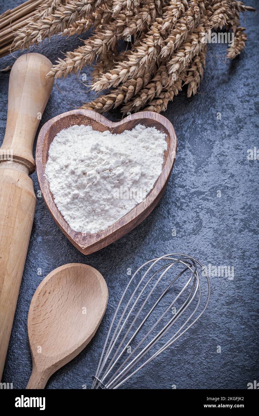 Wheat ears wooden spoon rolling-pin bowl flour egg whisk Stock Photo ...