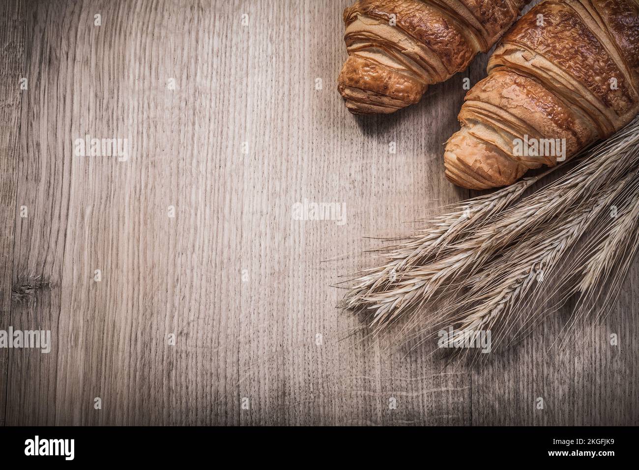 Wheat rye ears croissants on wooden board Stock Photo - Alamy