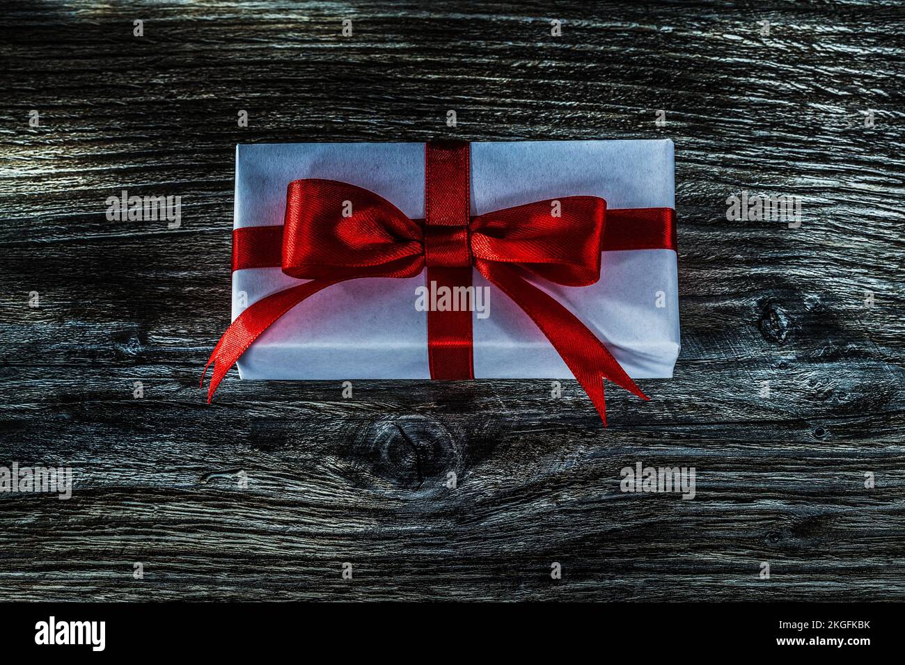 White gift box on wooden board Stock Photo - Alamy
