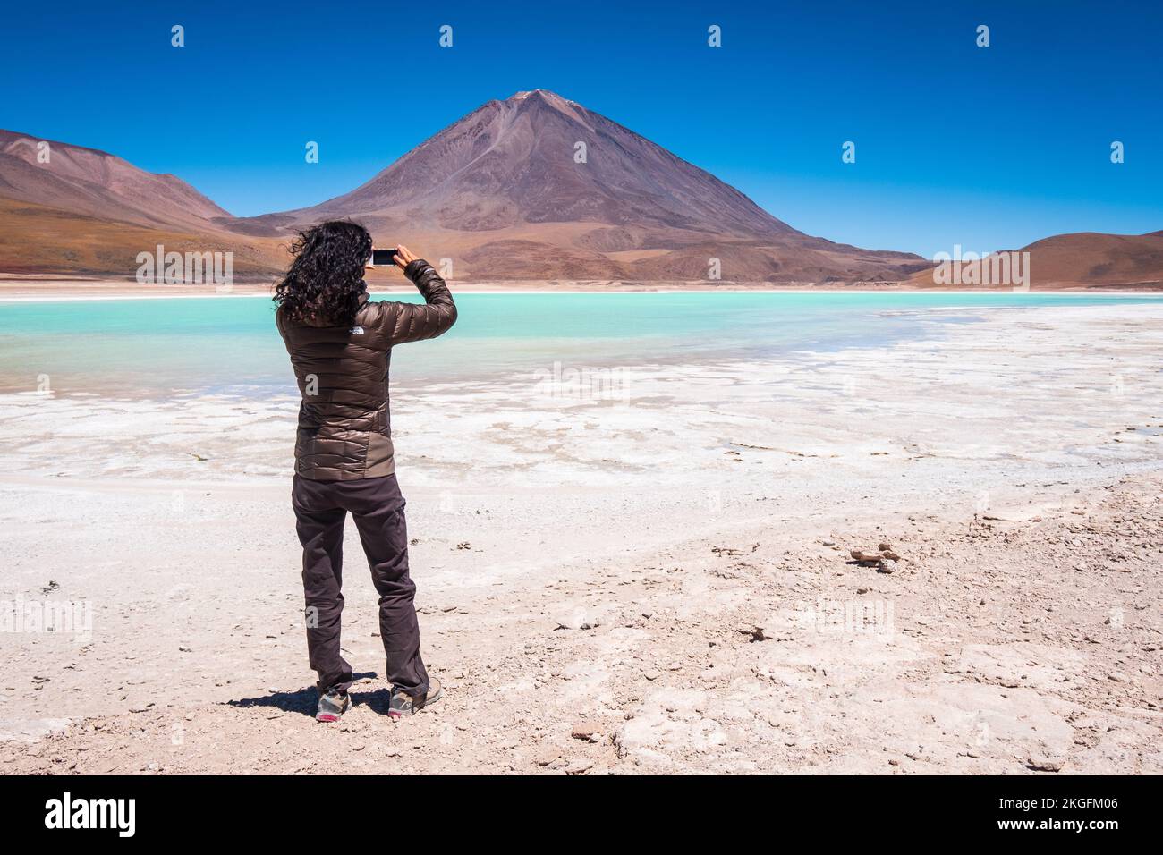 She photographs the Laguna Verde (Green Lagoon) with the Licancabur ...