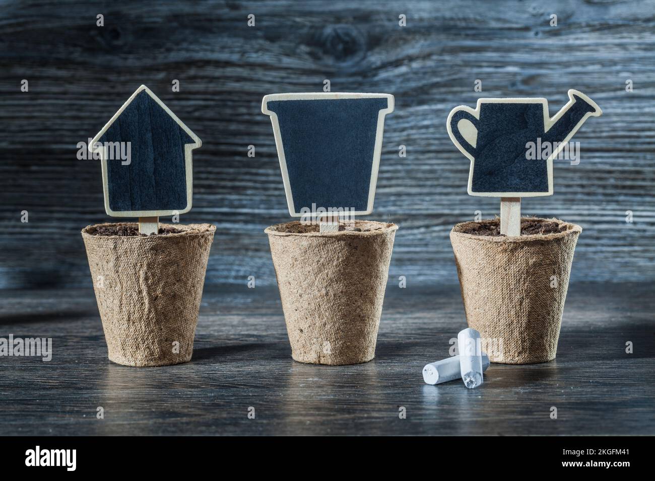 Wooden chalkboard price sign tags in peat pots Stock Photo - Alamy