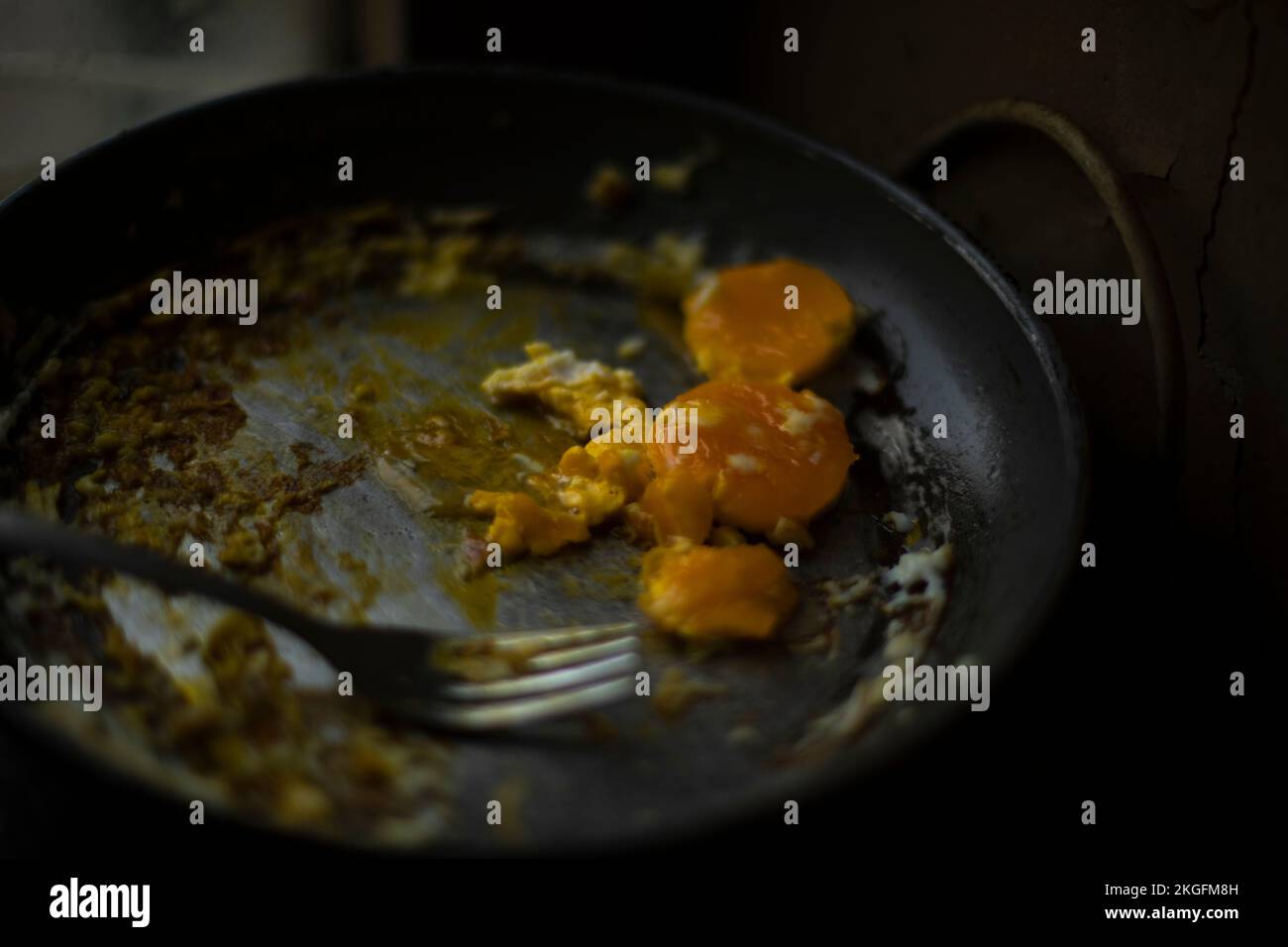 Scrambled eggs on frying pan. Egg yolk. Poor breakfast. Natural food ...