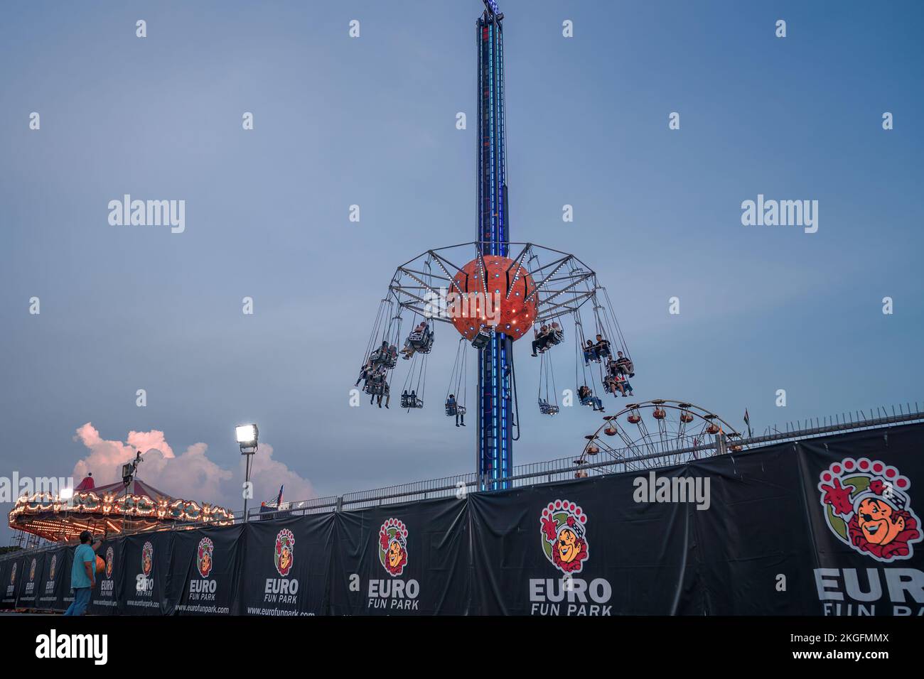 Bukit Jalil, Malaysia - Aug 16, 2022 Spinning tower chair with people ...