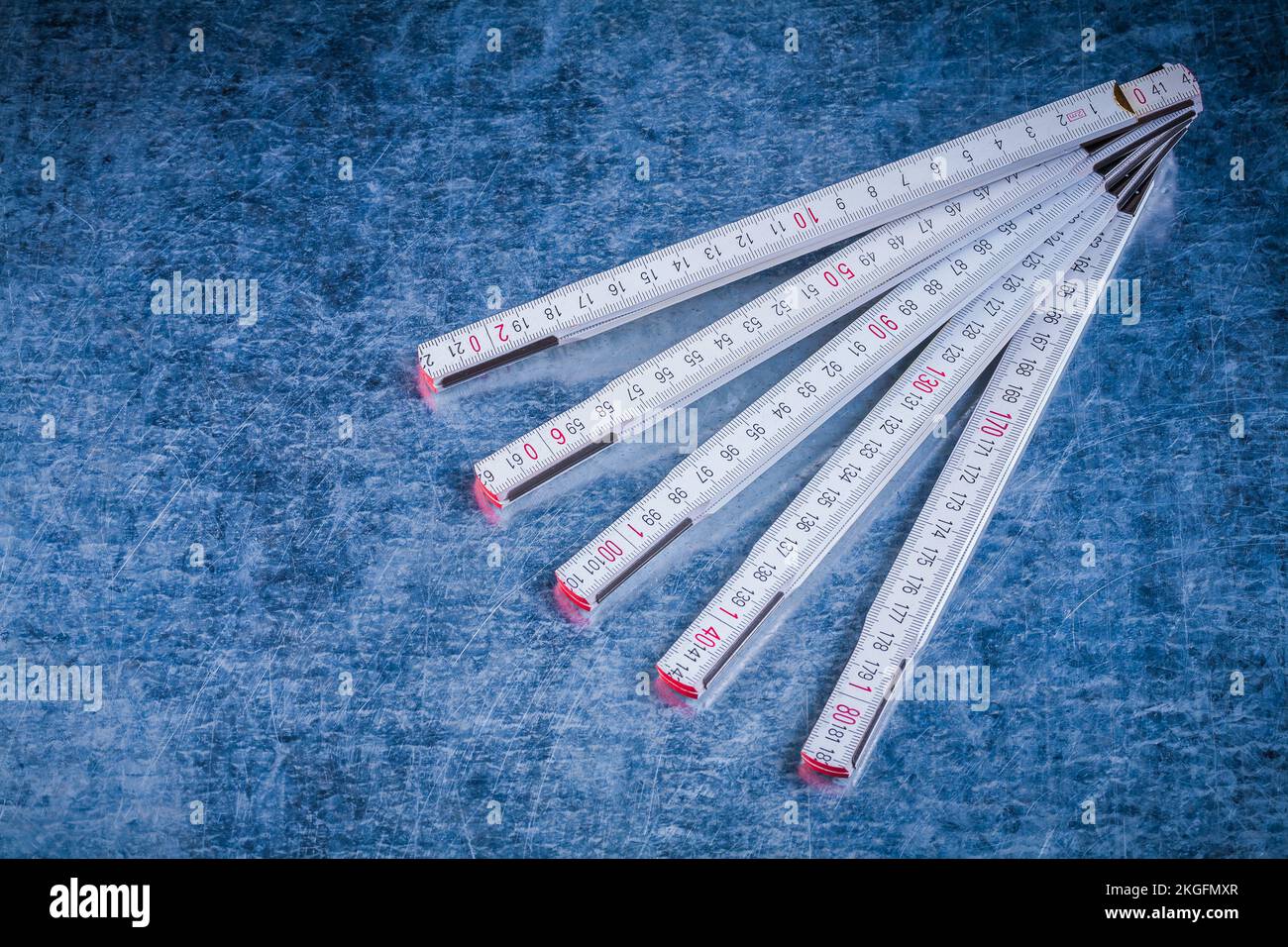 Wooden meter on scratched metallic surface construction concept Stock ...