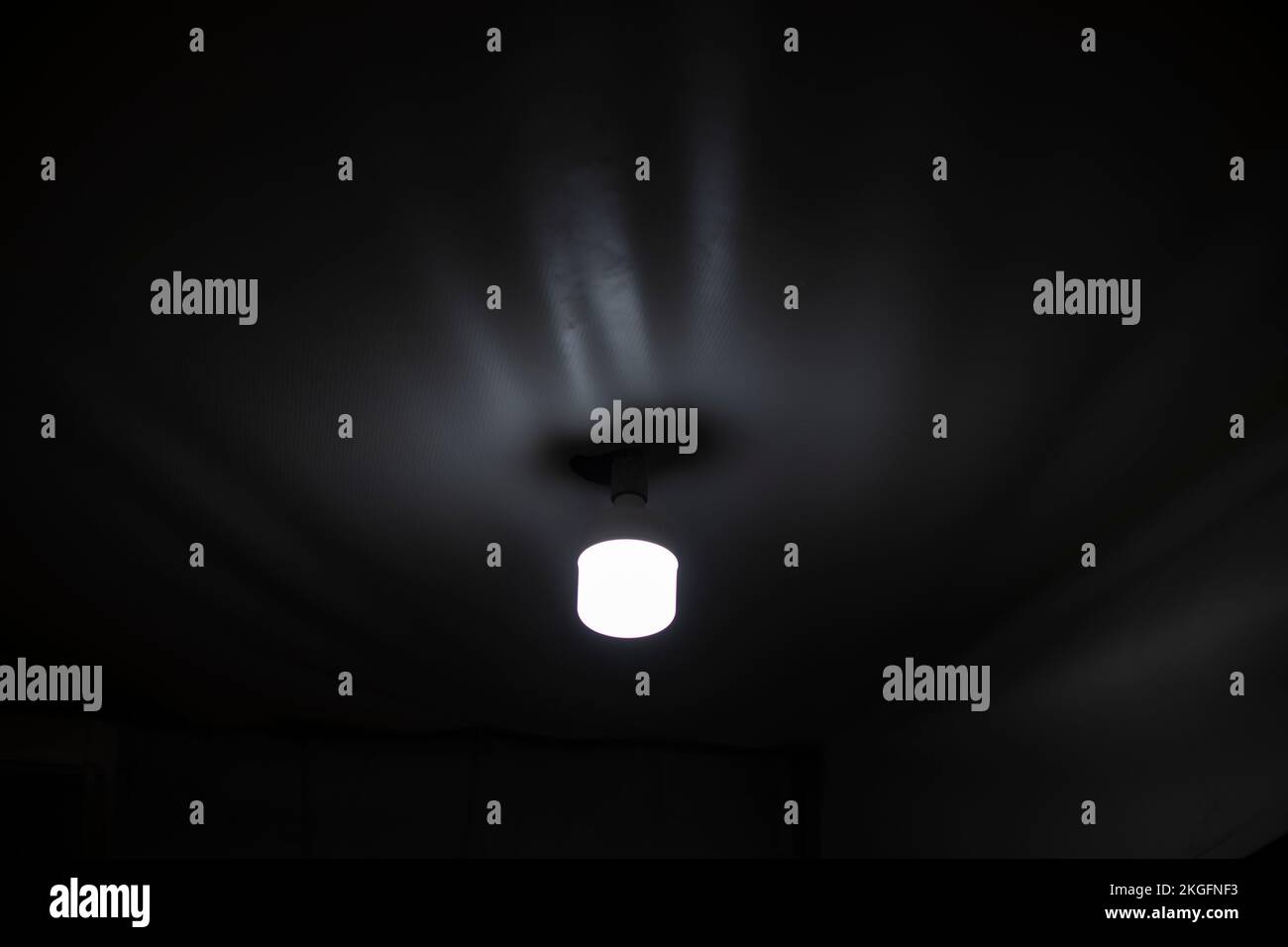 Lamp on ceiling. Dim light in room. Lighting device. Artificial ...