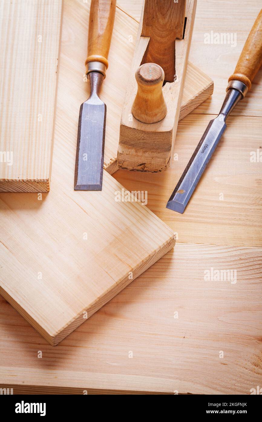woodworkers plane and carpentry chisels on wooden boards Stock Photo ...