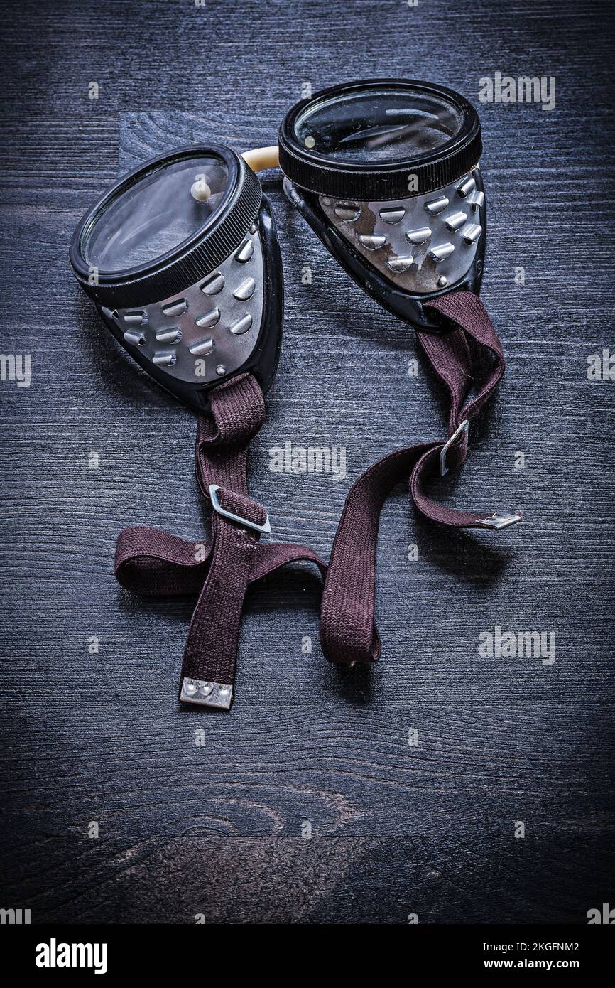working goggles on vintage board Stock Photo - Alamy
