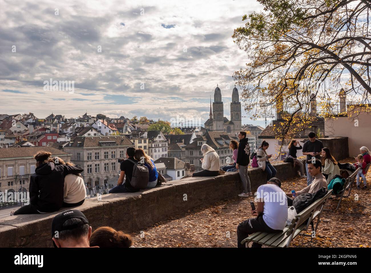 Young people looking over the River Limmat near Lindenhof in Zurich ...