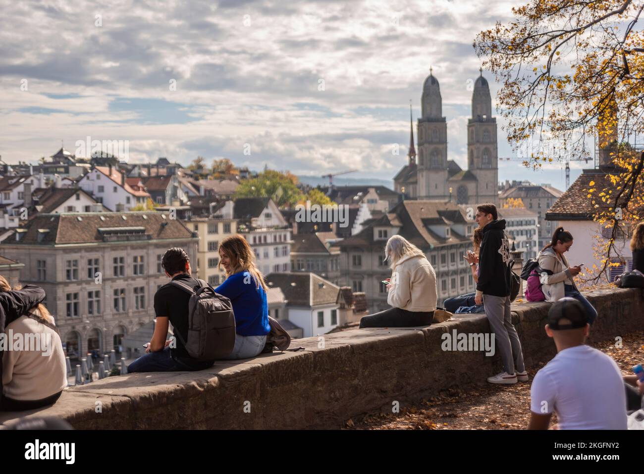 Young people looking over the River Limmat near Lindenhof in Zurich ...