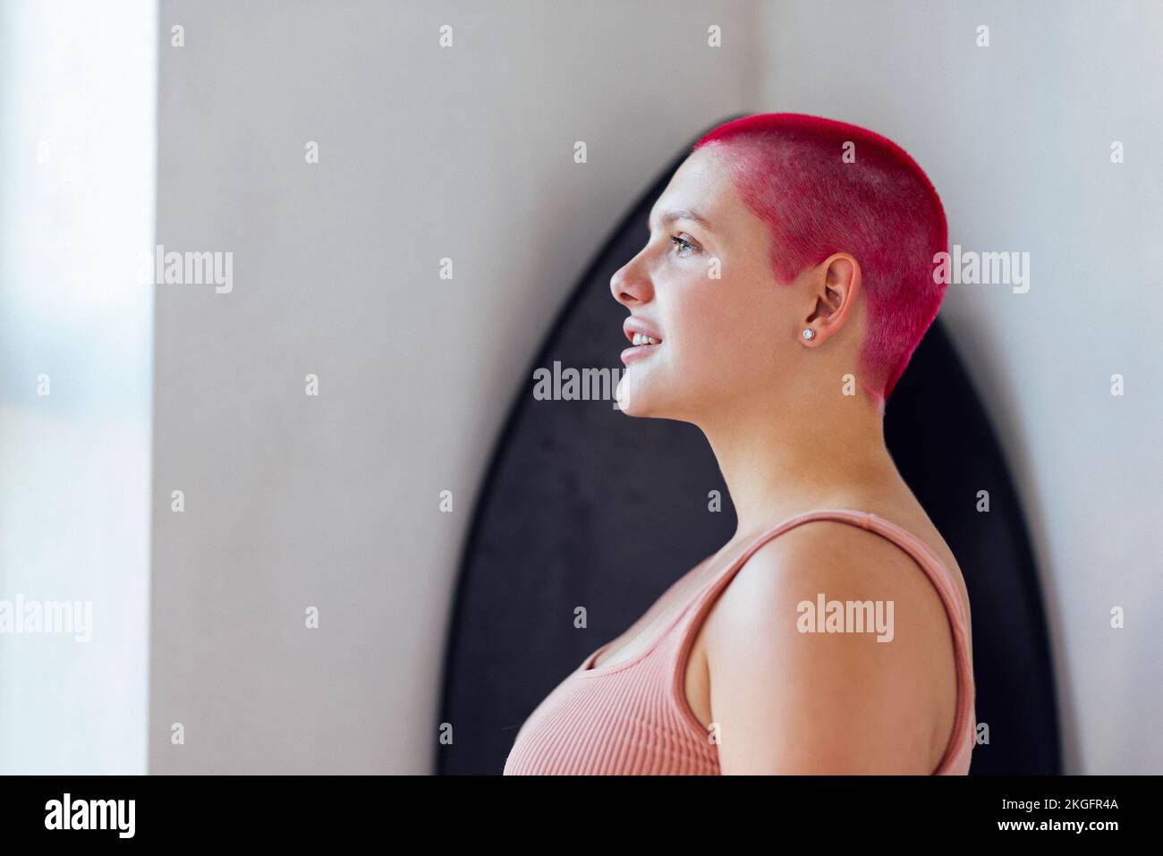 Surfer, redhead bald woman by board going to the beach. Water sports ...