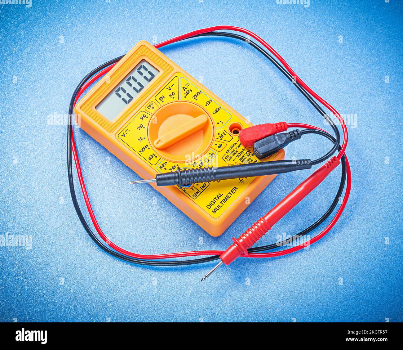 Yellow electrical digital gauge on blue background electricity concept ...
