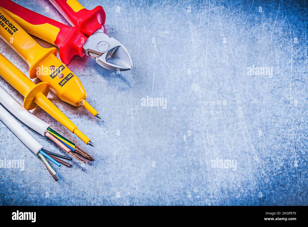 Yellow electrical tester wires nippers on metallic background copy ...
