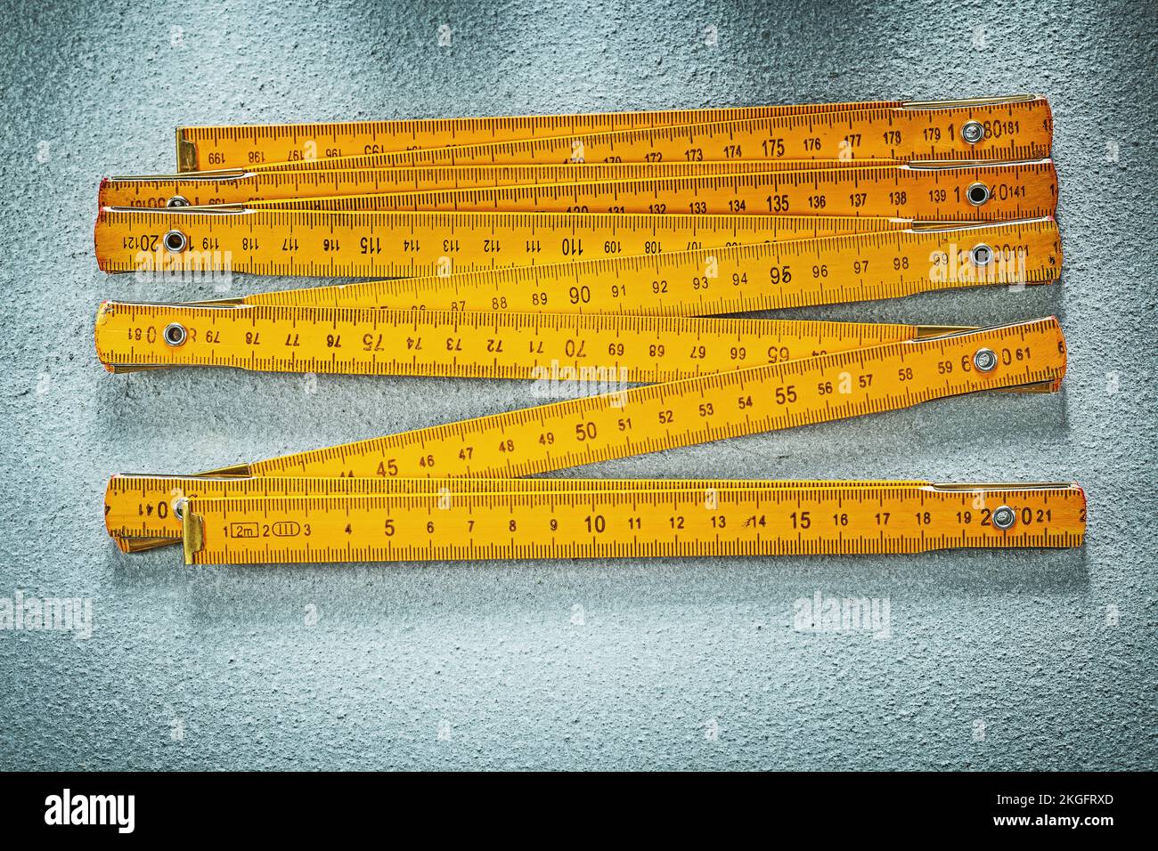 Yellow wooden meter on concrete surface construction concept Stock ...