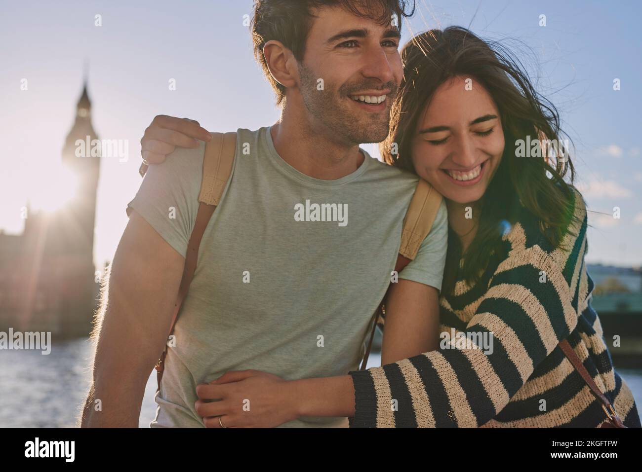 Travel, love and couple hug at big ben for happy holiday, adventure and ...