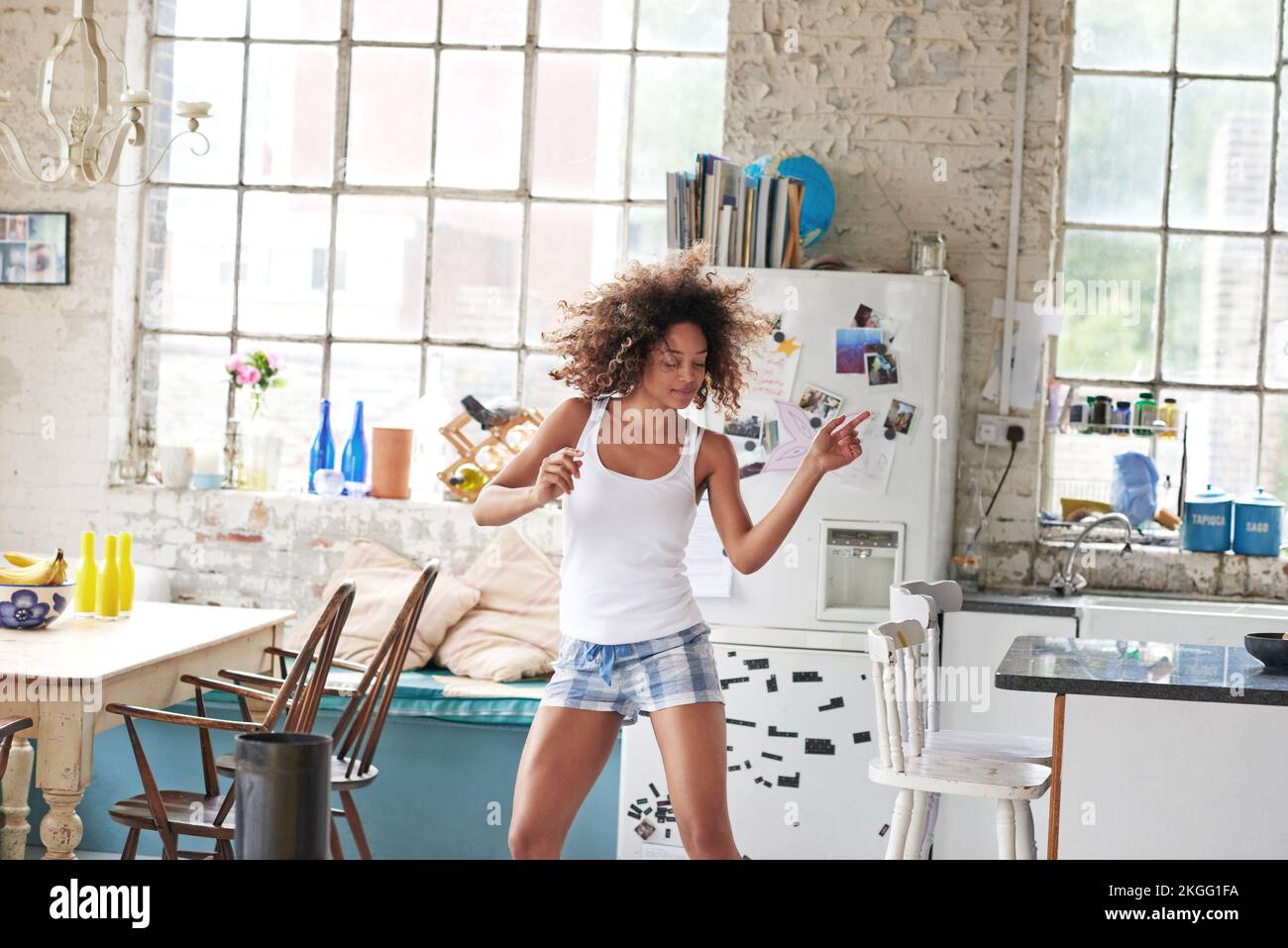 Woman, comic dance and crazy in kitchen at home for energy wellness ...