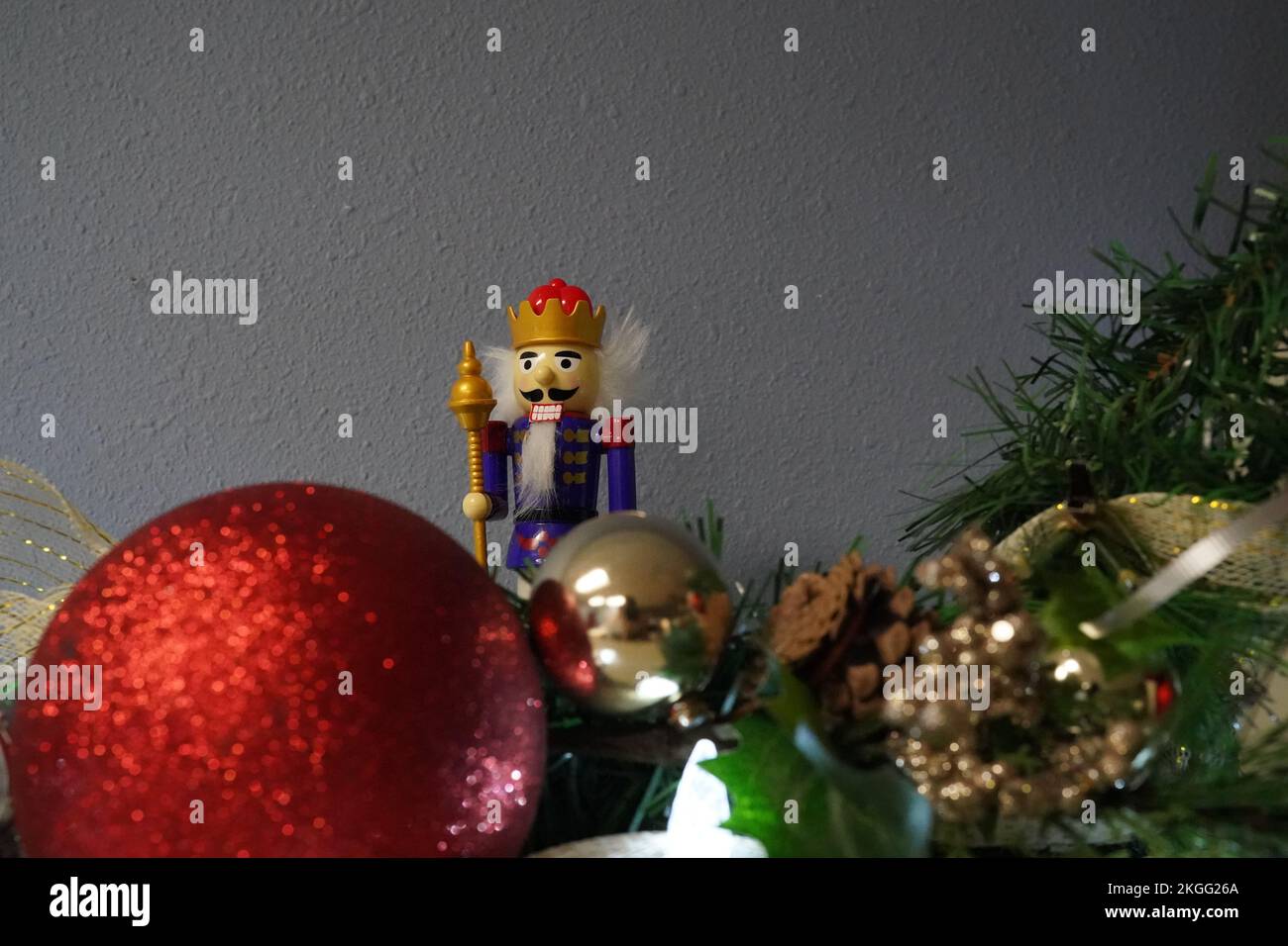 A small king figurine and colorful balls for Christmas decorations ...