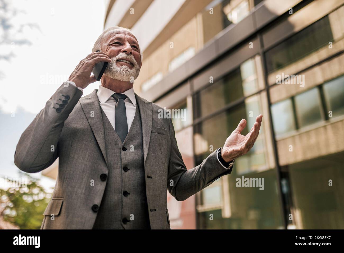 Standing gesturing communication leadership building exterior hi-res ...