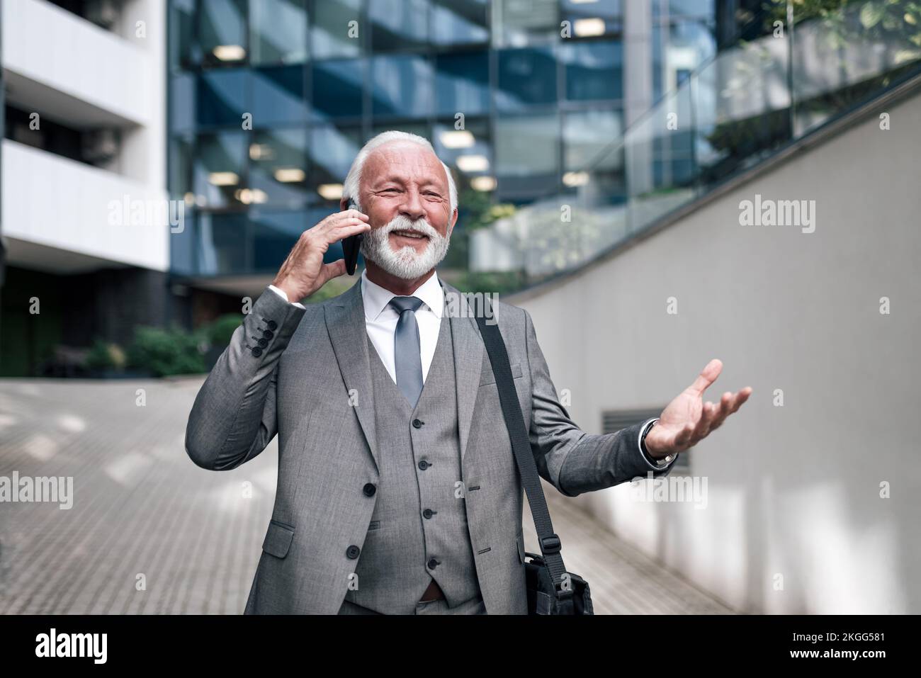 Standing gesturing communication leadership building exterior hi-res ...