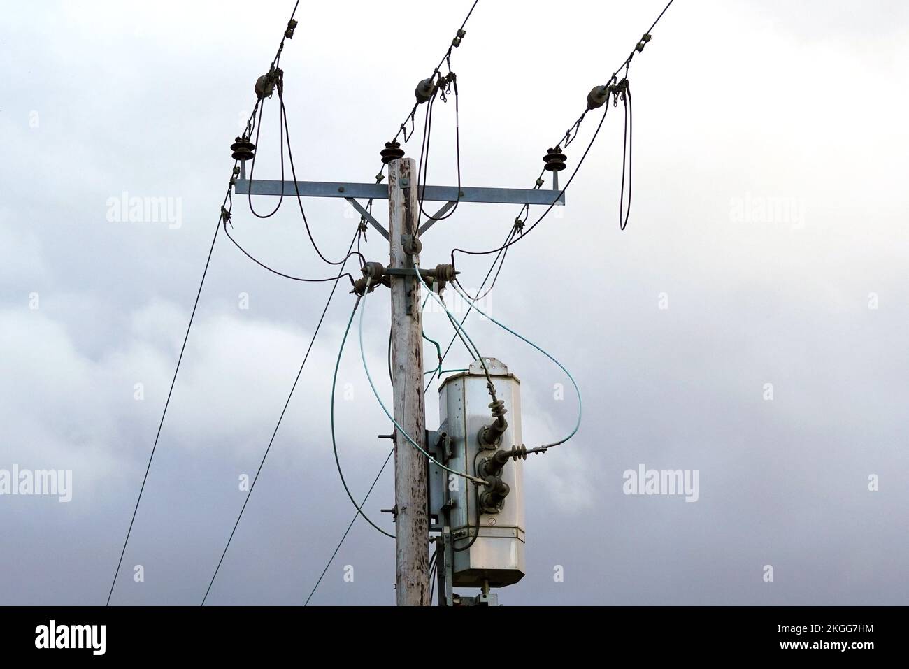 UK Telephone Wires join a Telegraph Pole Stock Photo - Alamy