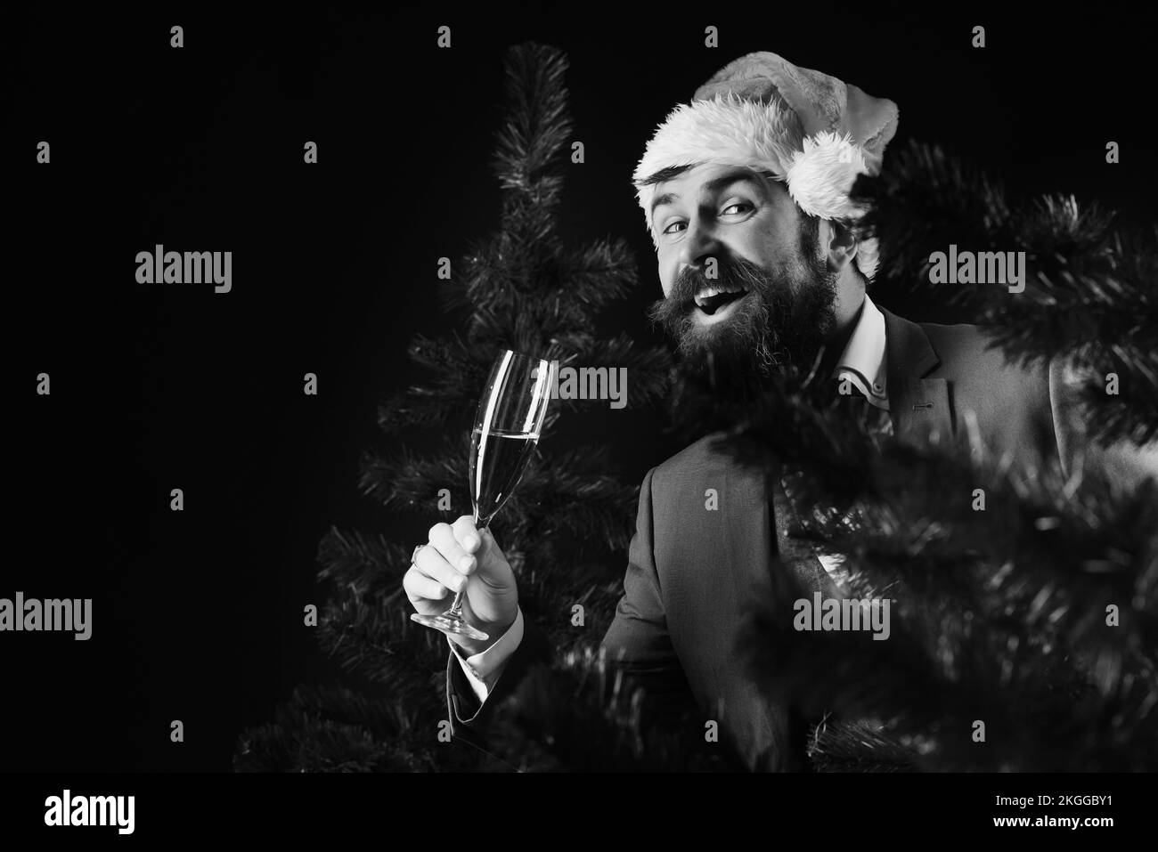 Manager with beard hides behind bald Christmas tree Stock Photo - Alamy